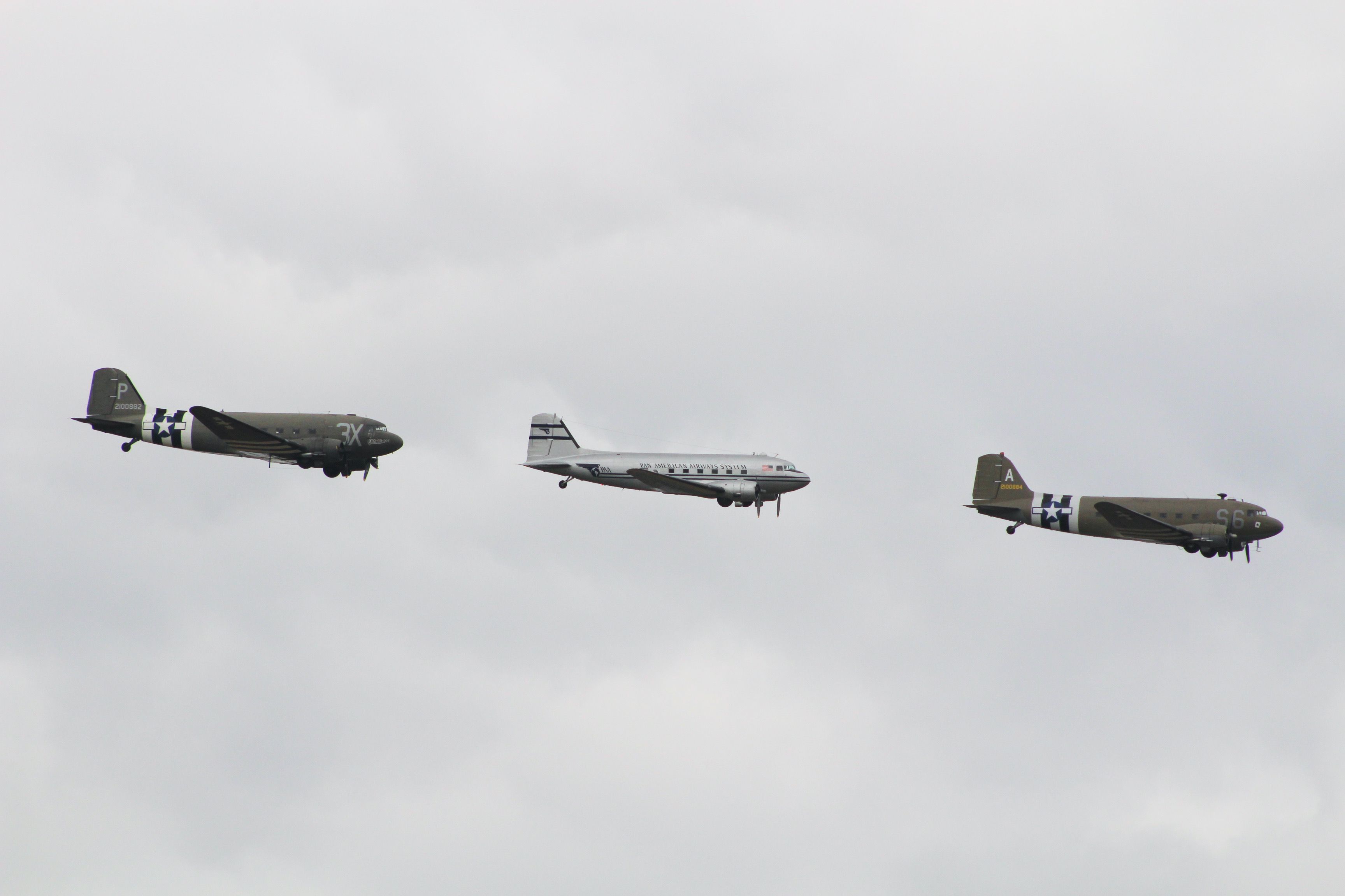Bombers Flying under Clouds · Free Stock Photo