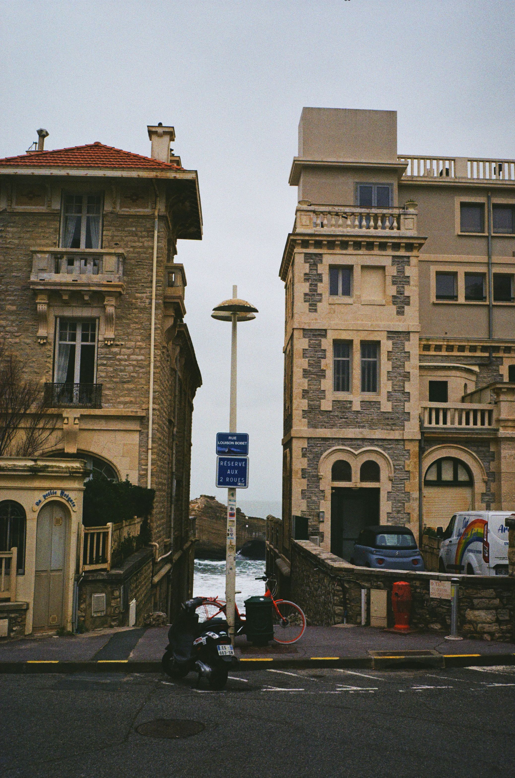 Streetlight between Two Buildings · Free Stock Photo