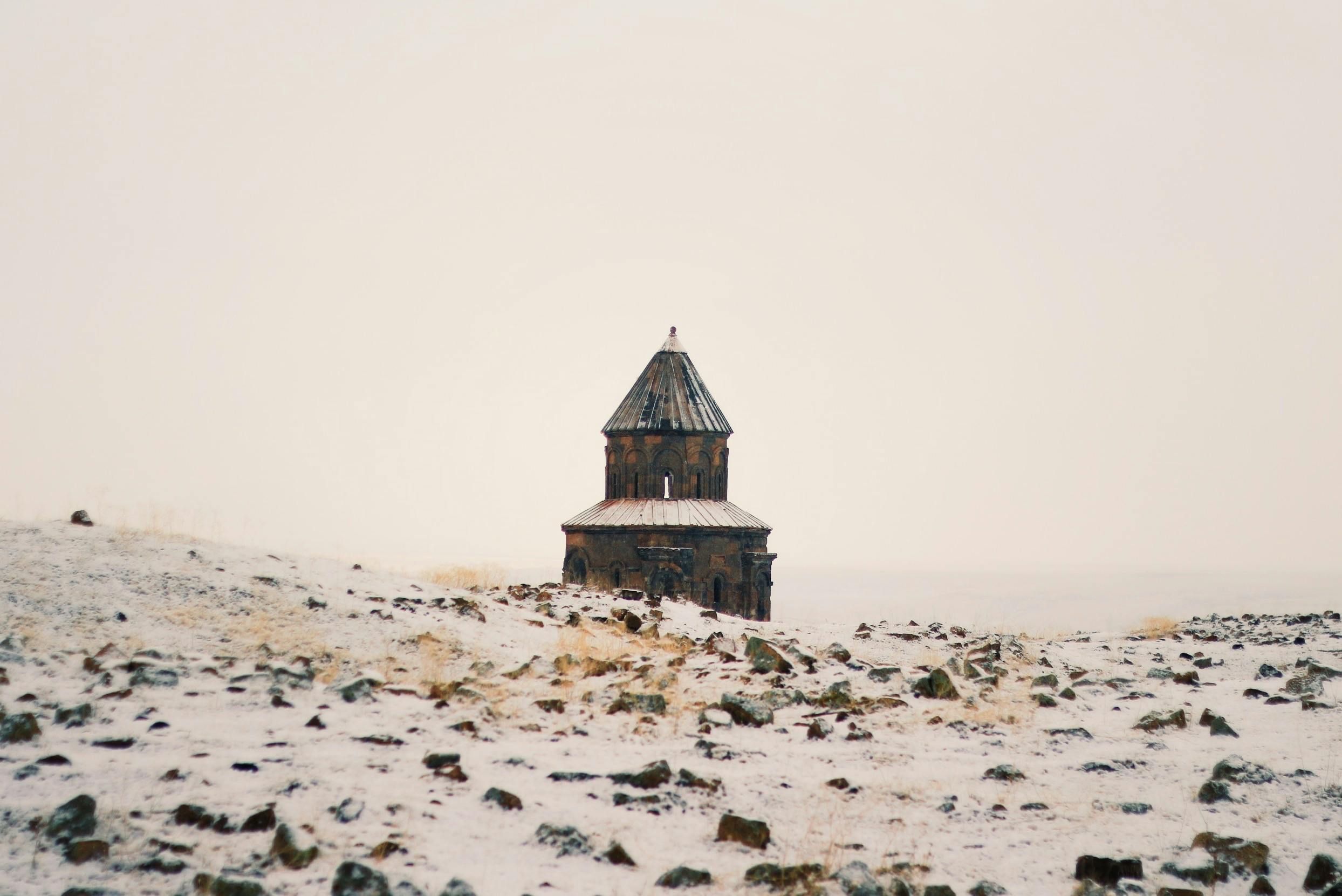 A Ruined Brown Brick Building Covered With Snow During Winter · Free ...