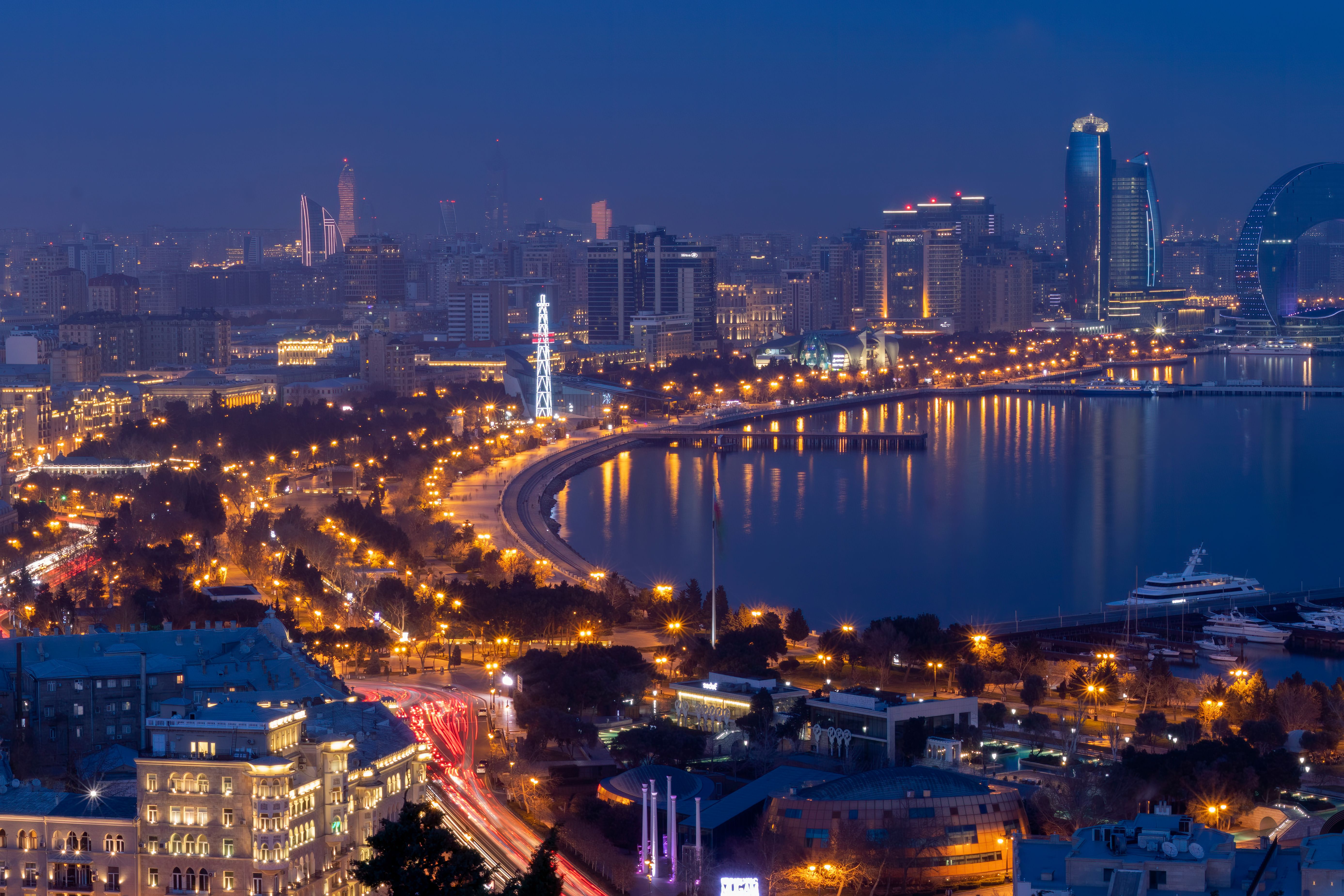 The city of baku at night with lights and water · Free Stock Photo