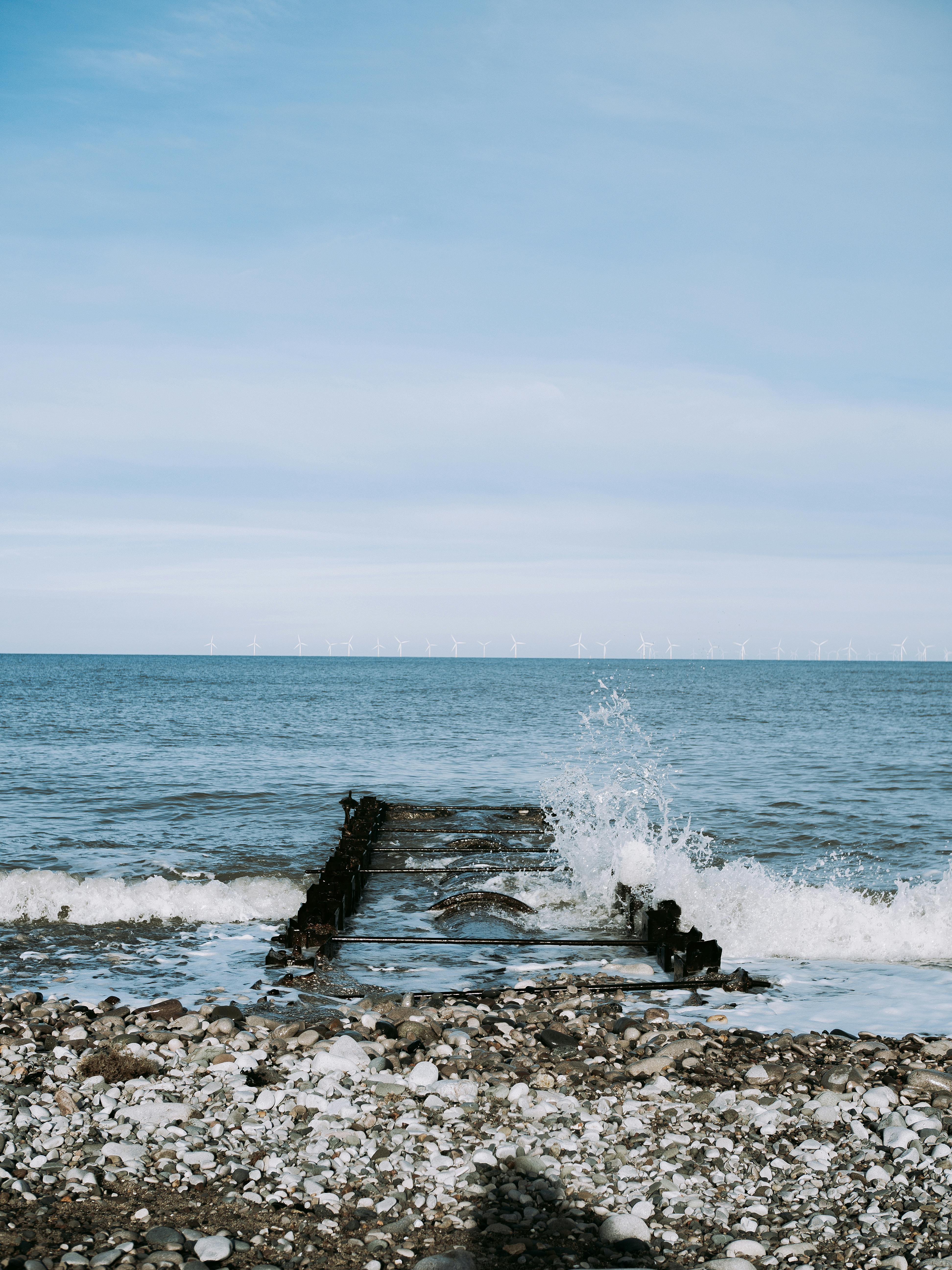Tide Falling over a Wooden Pier · Free Stock Photo