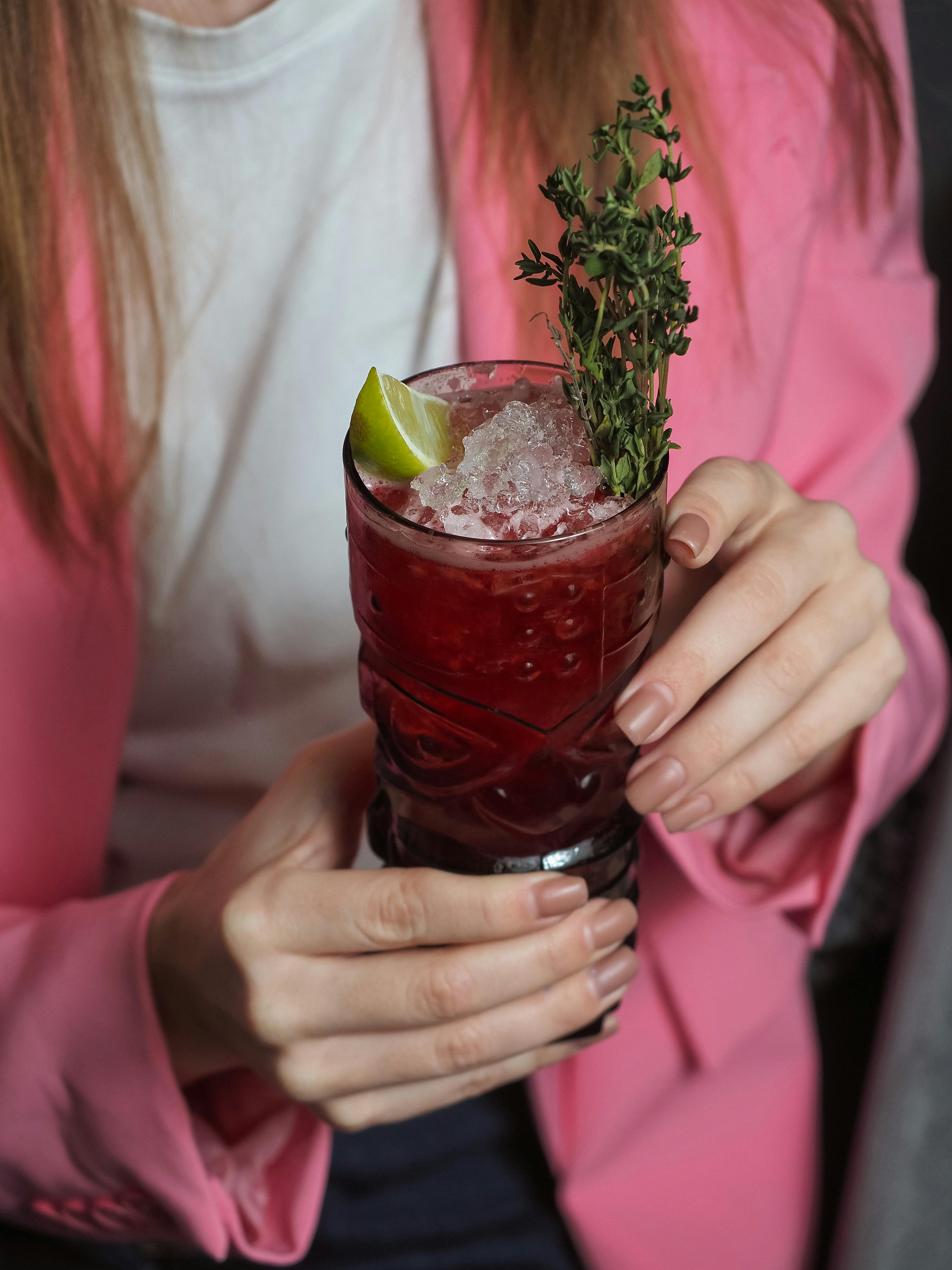 Woman in White Sweater Holding a Glass of Blue Milk Shake Cocktail ...