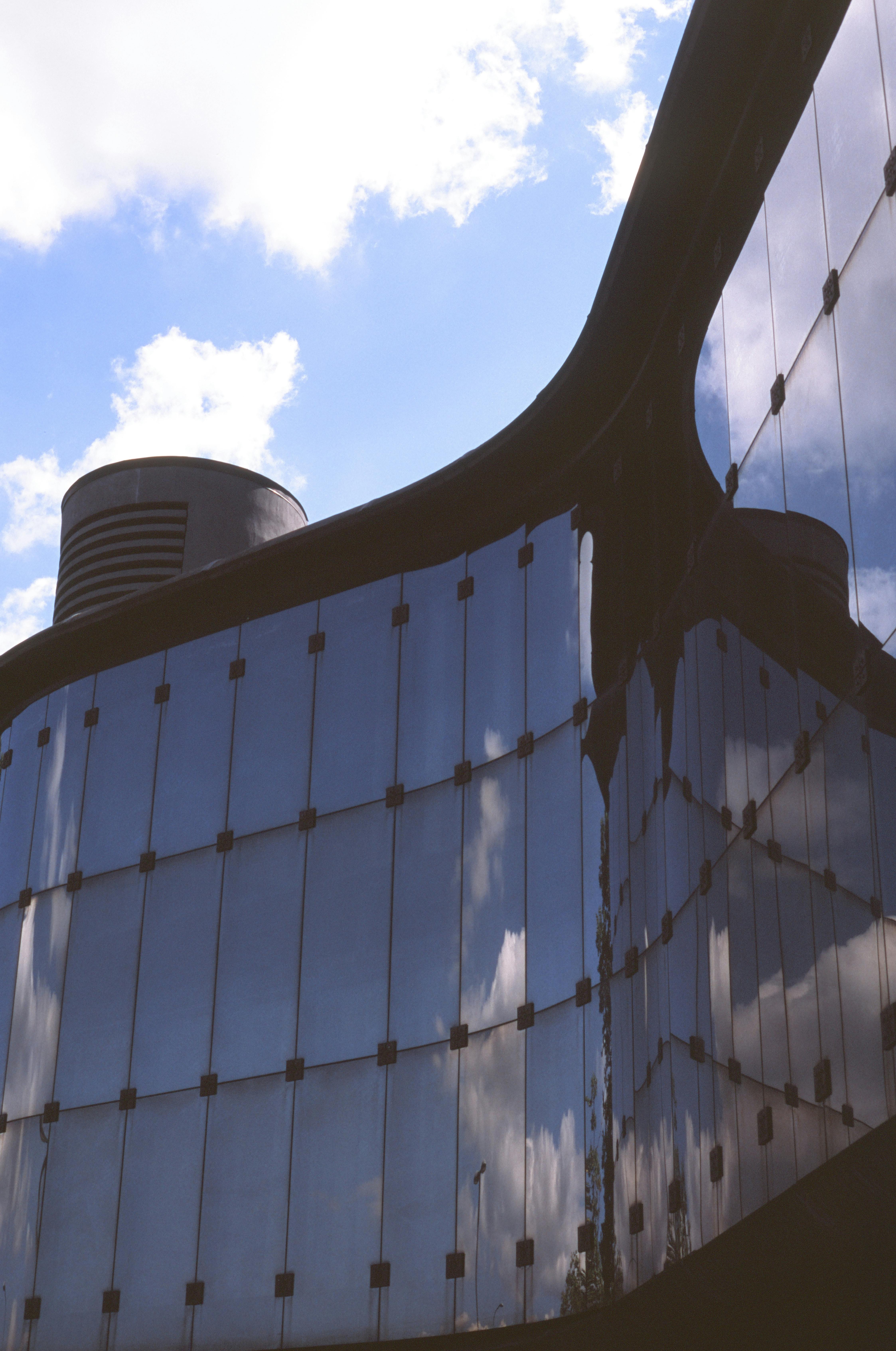 Modern Glass Building in Sunlight · Free Stock Photo