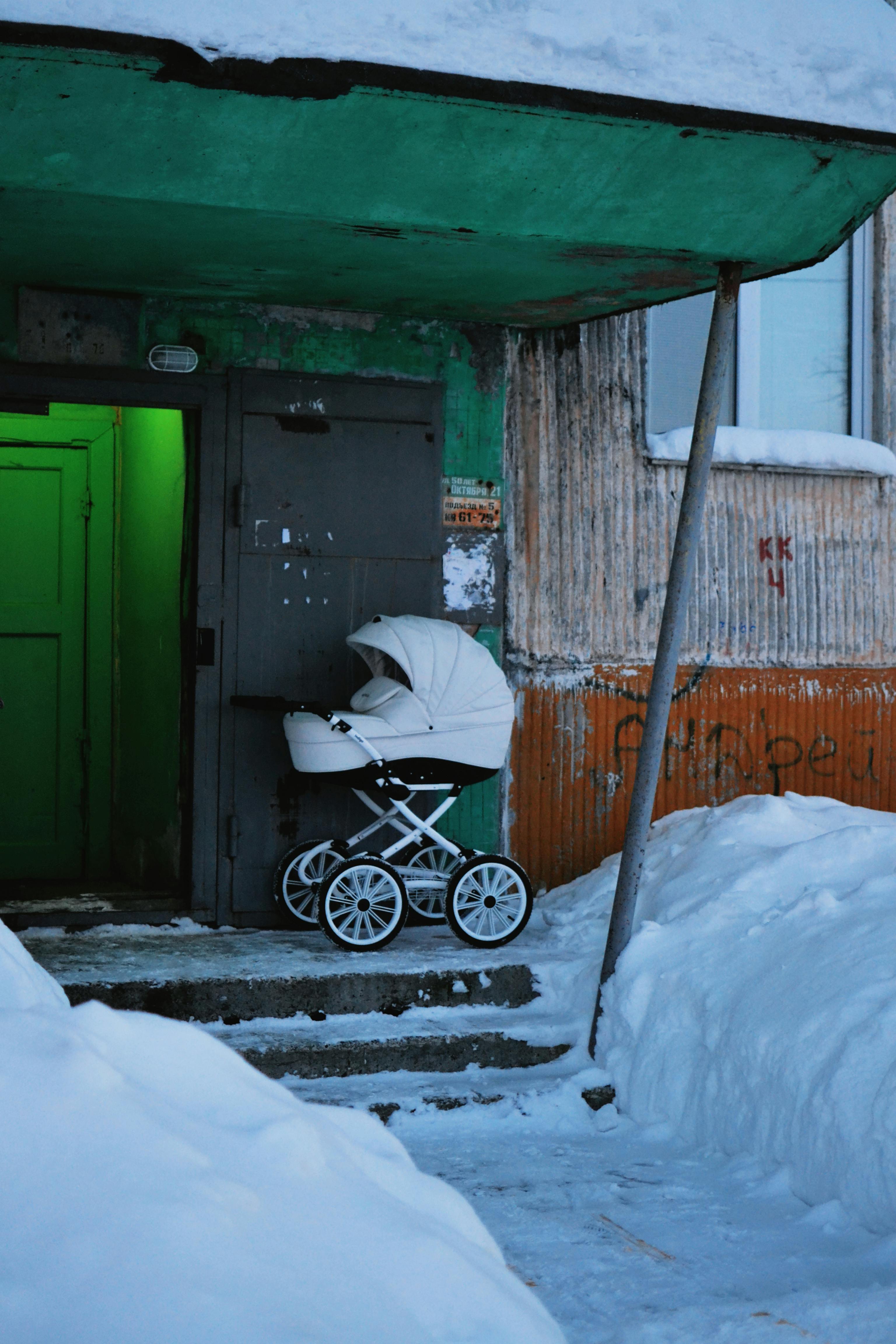 Snow-Covered Sidewalk in Front of a Nightclub Entrance · Free Stock Photo