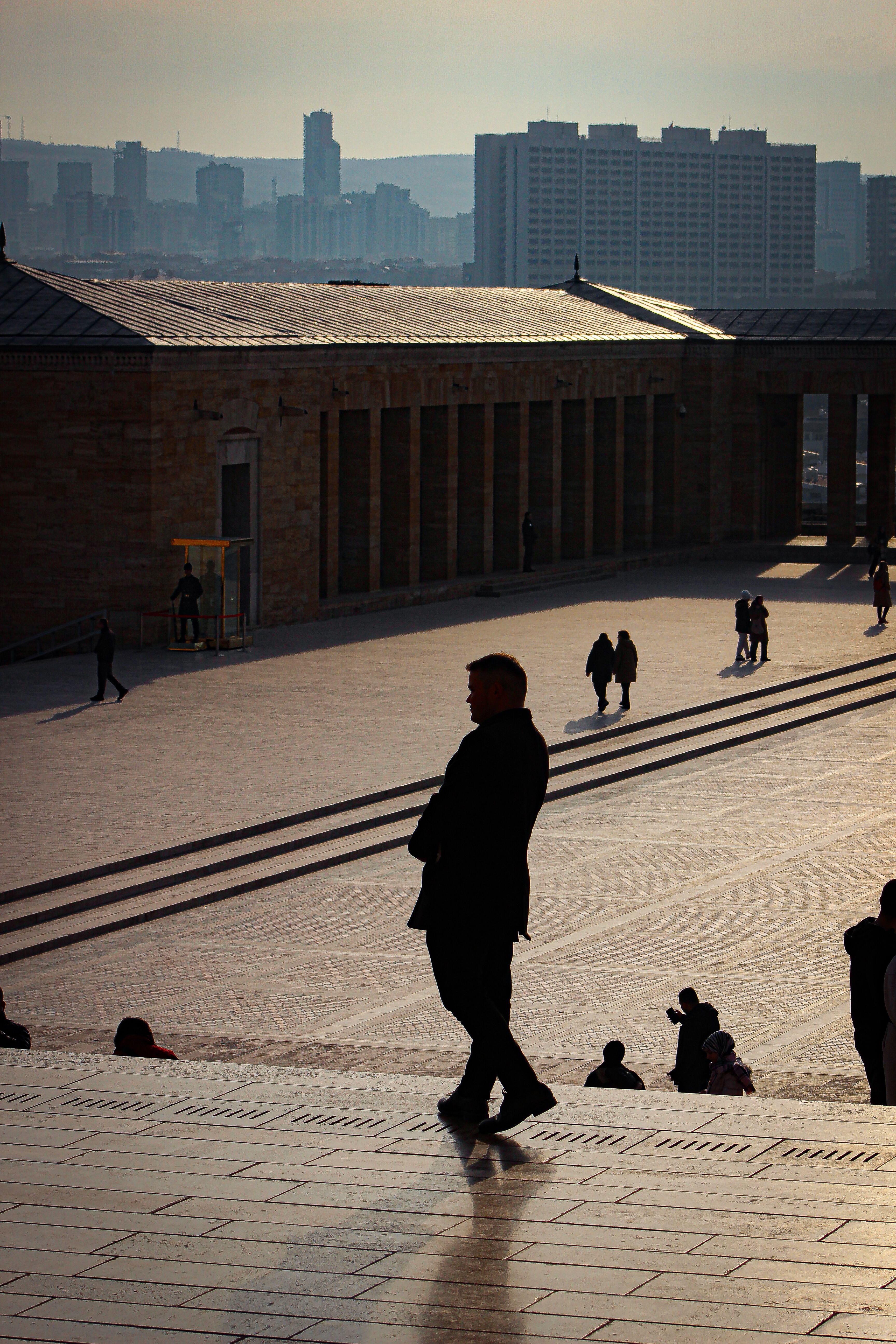 People on Sunlit Square in City · Free Stock Photo