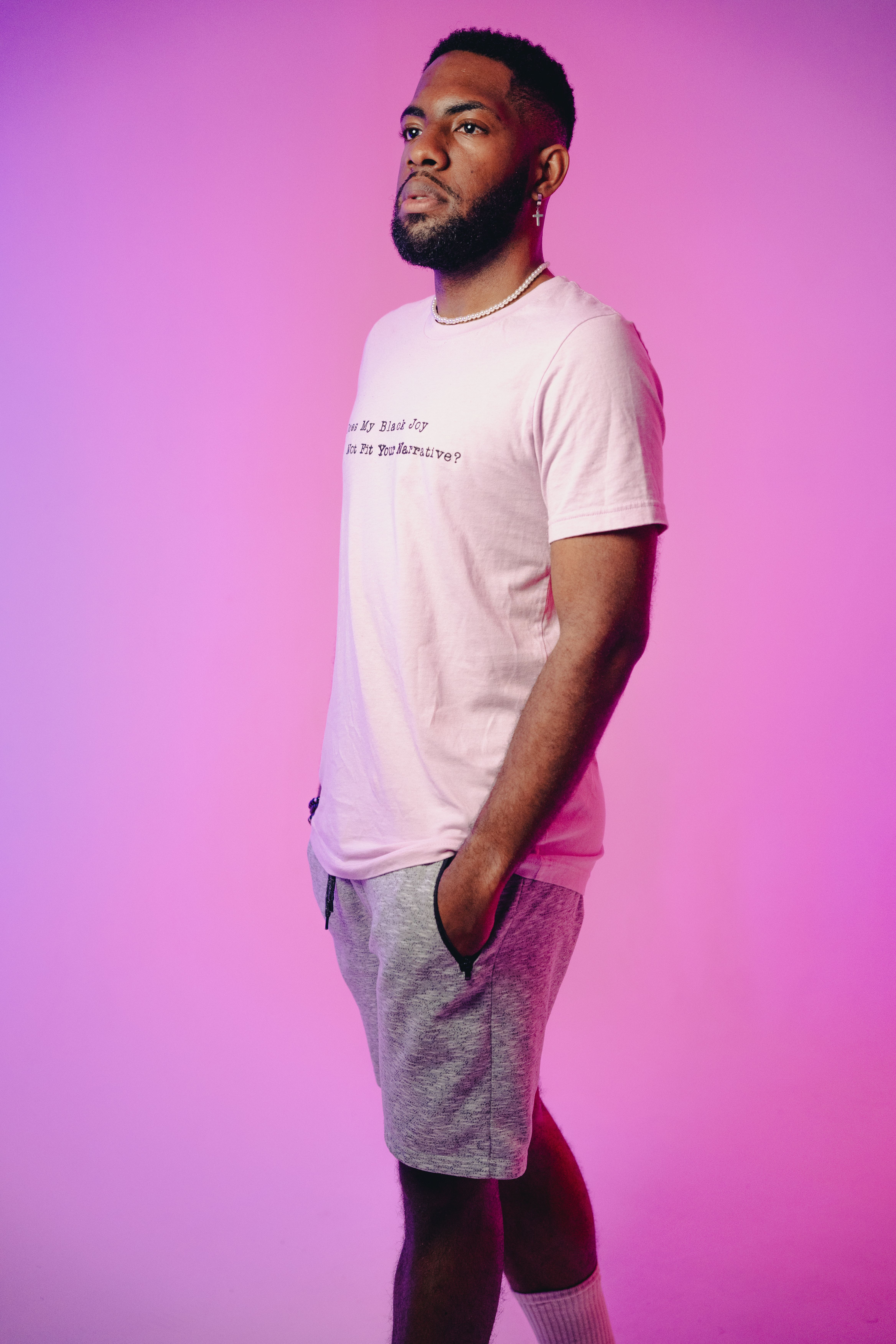 Man Posing on Pink Background · Free Stock Photo
