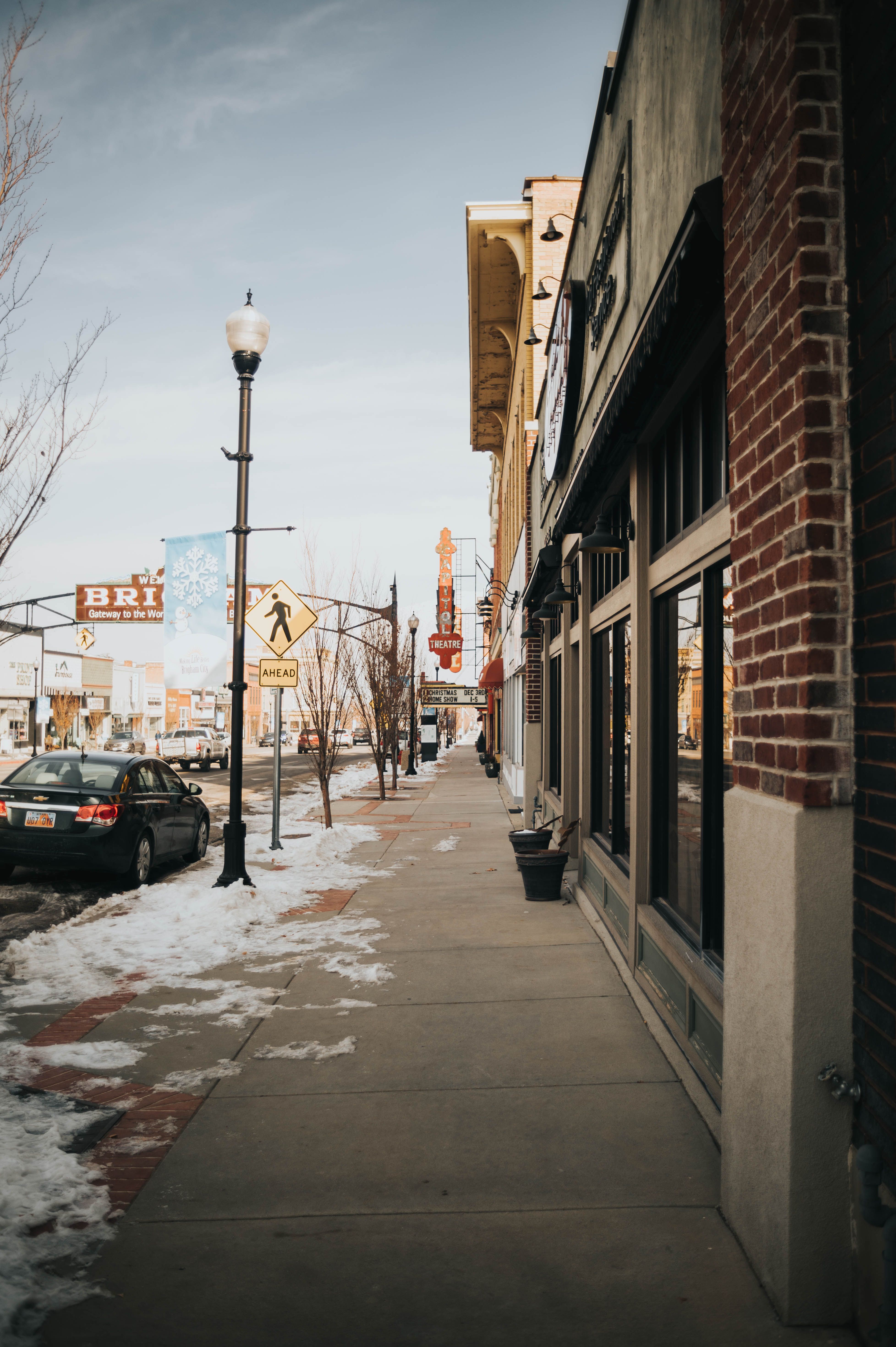 View of a Sidewalk along Building and Street in City · Free Stock Photo