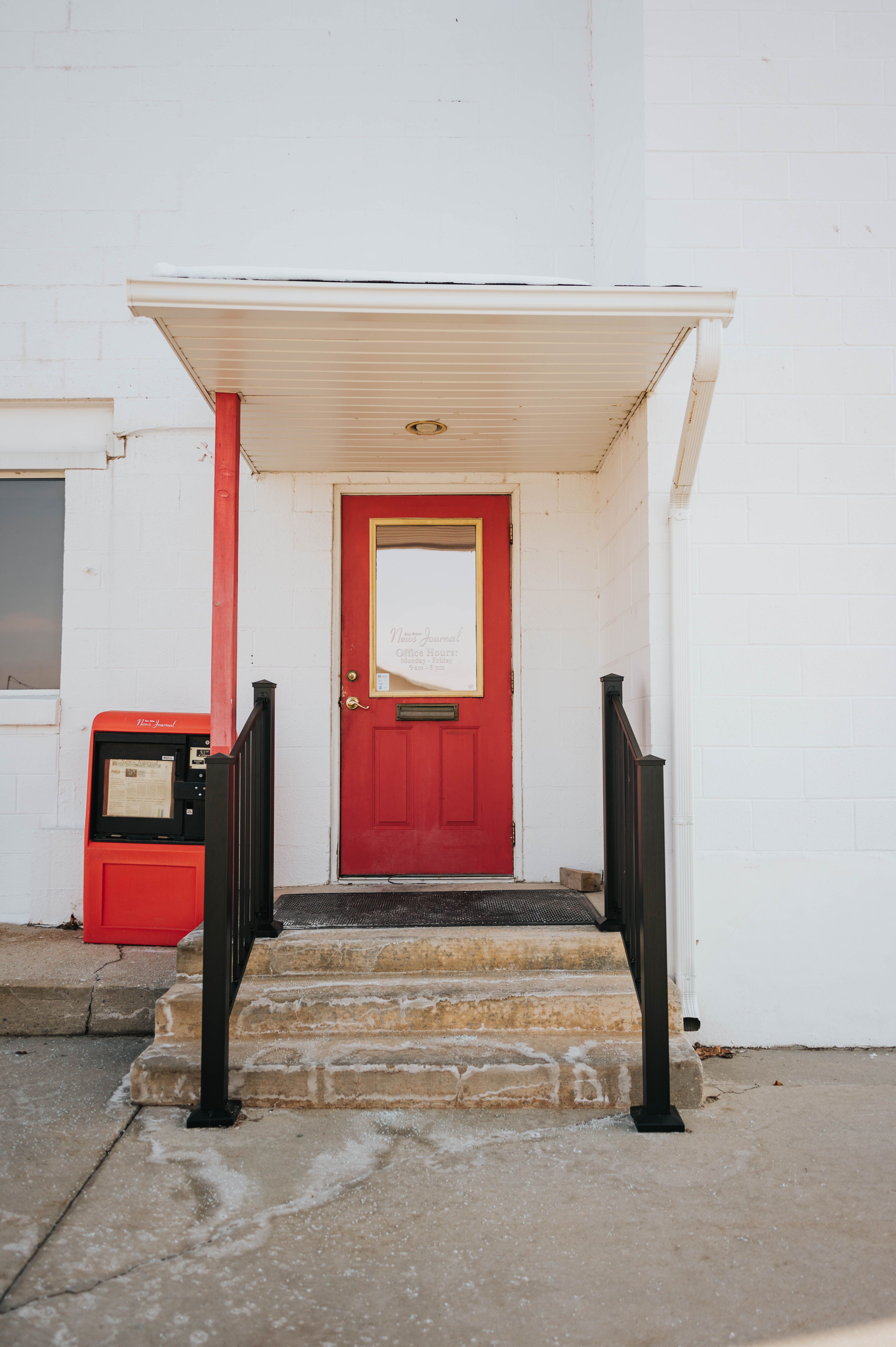 Entrance to a Post Office Building and a Red Mailbox Standing by the ...