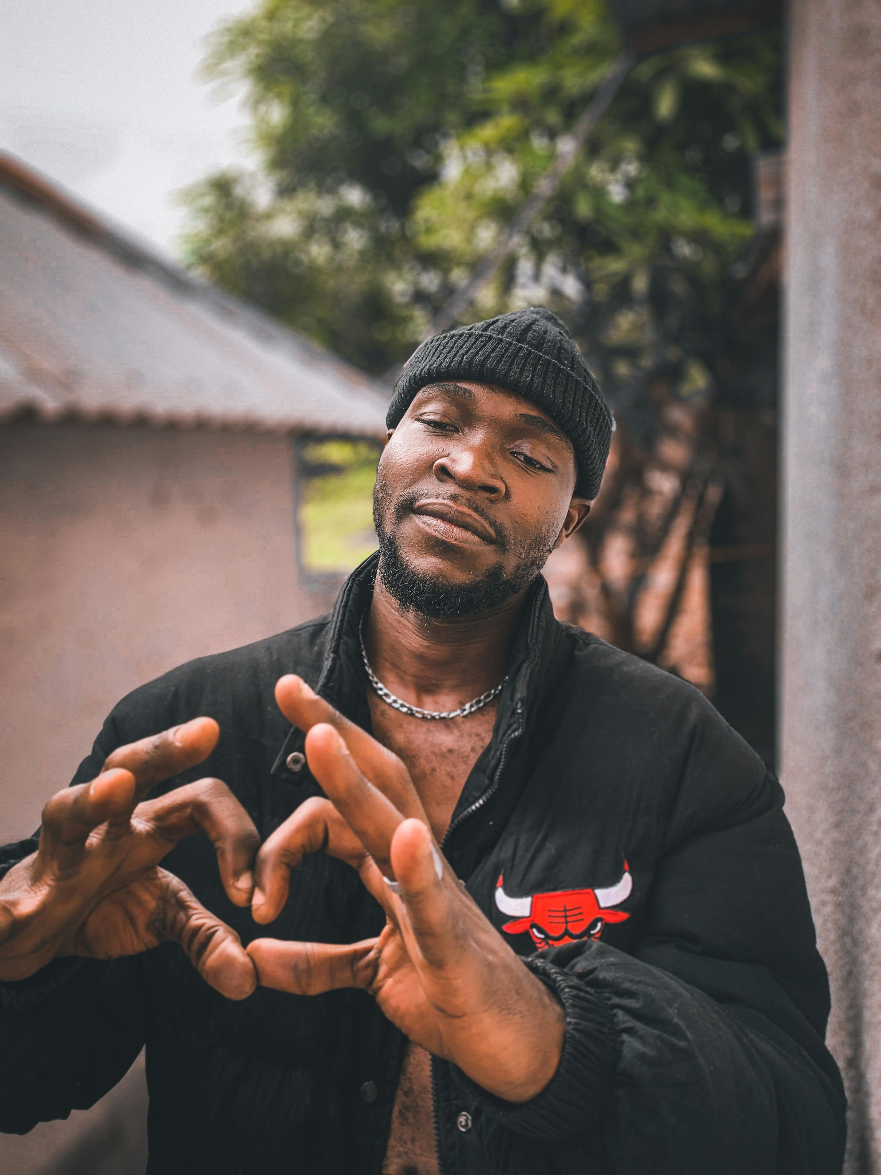 Person Showing Right Hand With Black Tattoo · Free Stock Photo