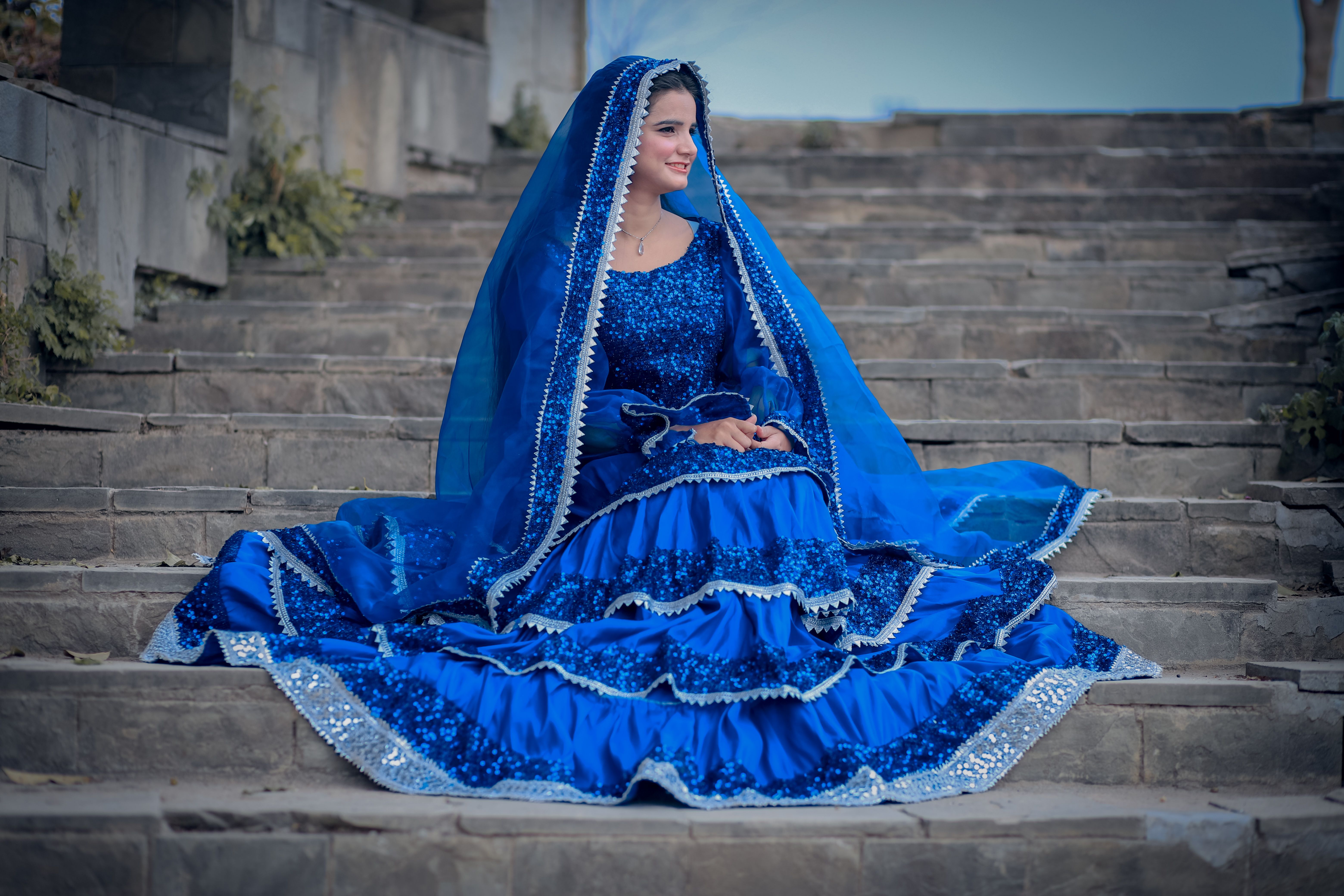 Woman Sitting in Blue, Traditional Dress · Free Stock Photo