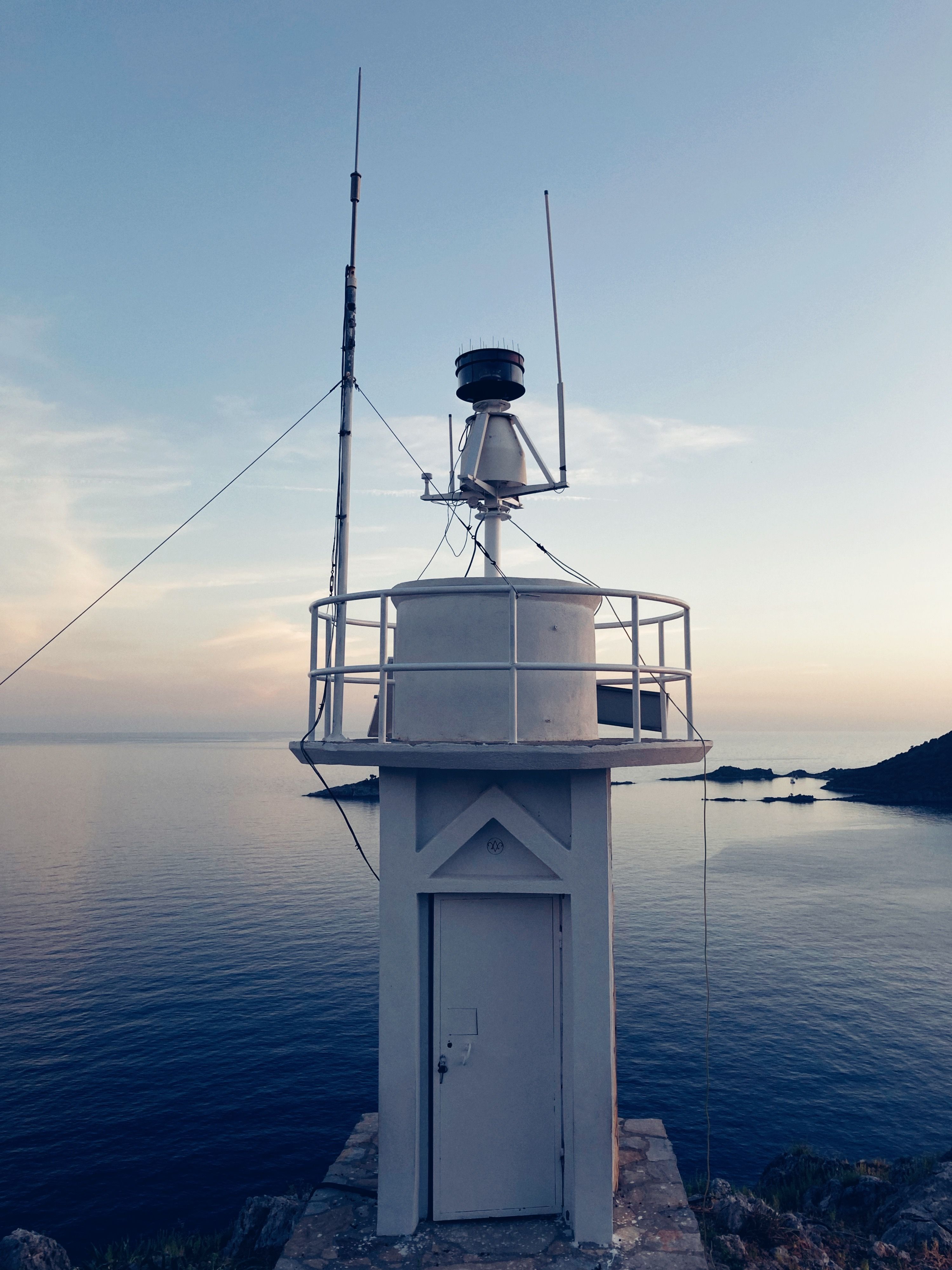 White Lighthouse on Sea Shore · Free Stock Photo