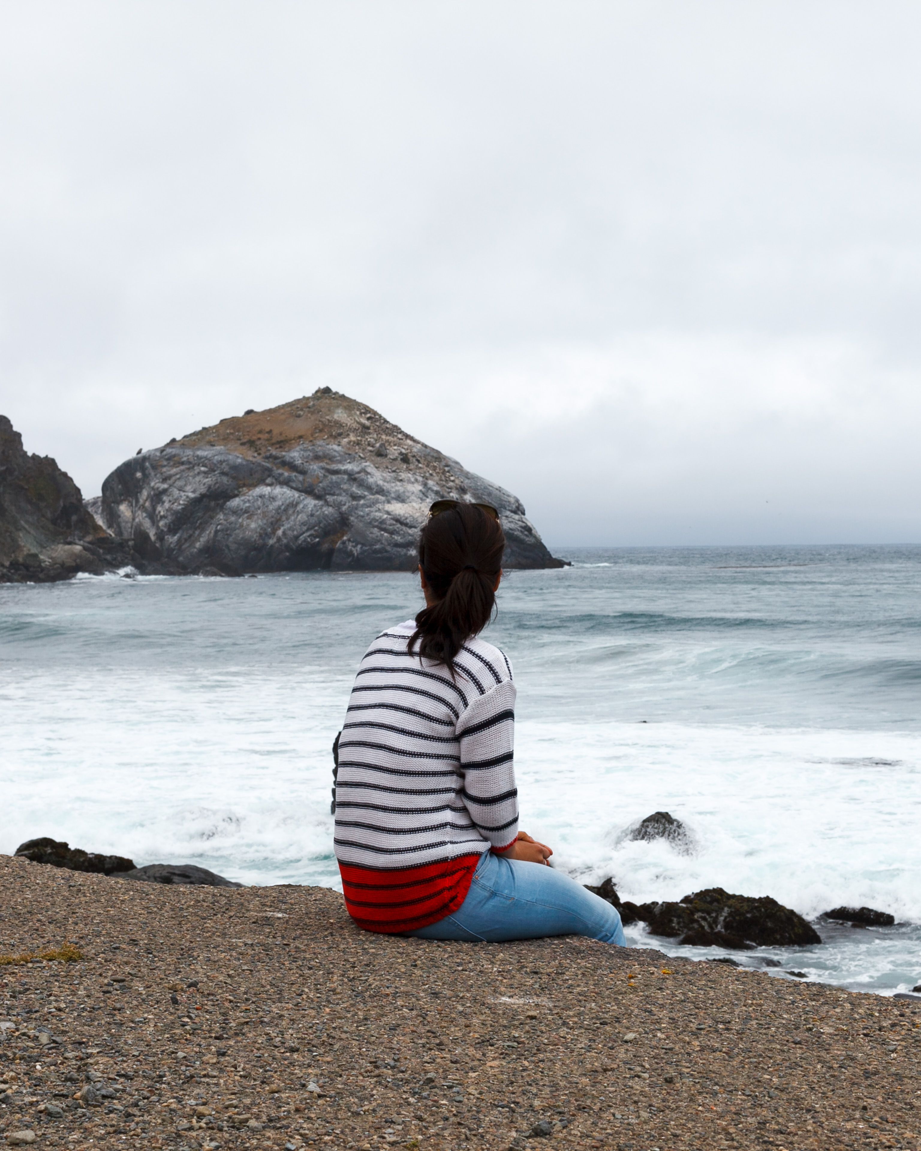 Woman Sitting Alone on a Beach · Free Stock Photo