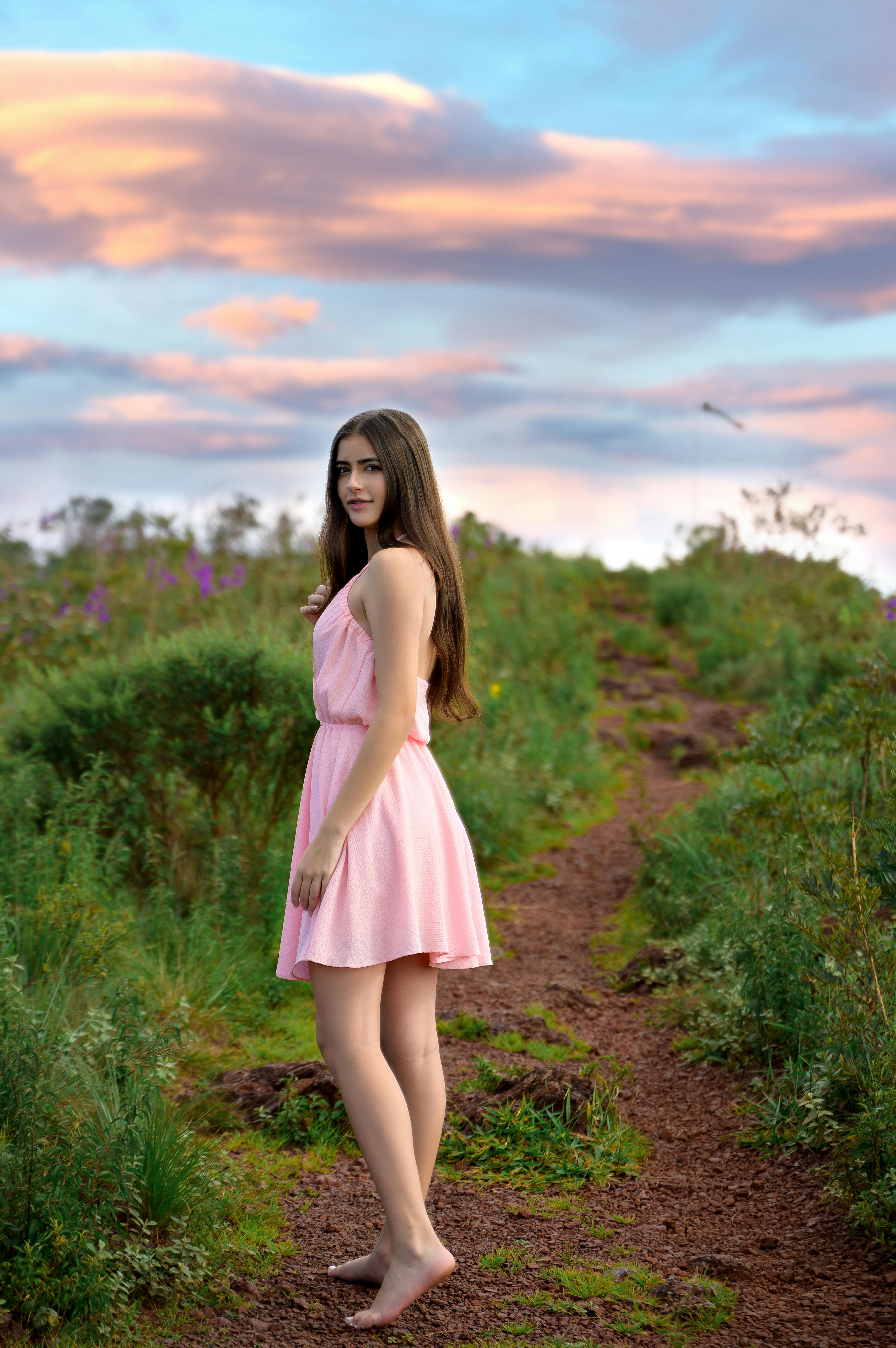 Woman in Dress Standing among Plants · Free Stock Photo