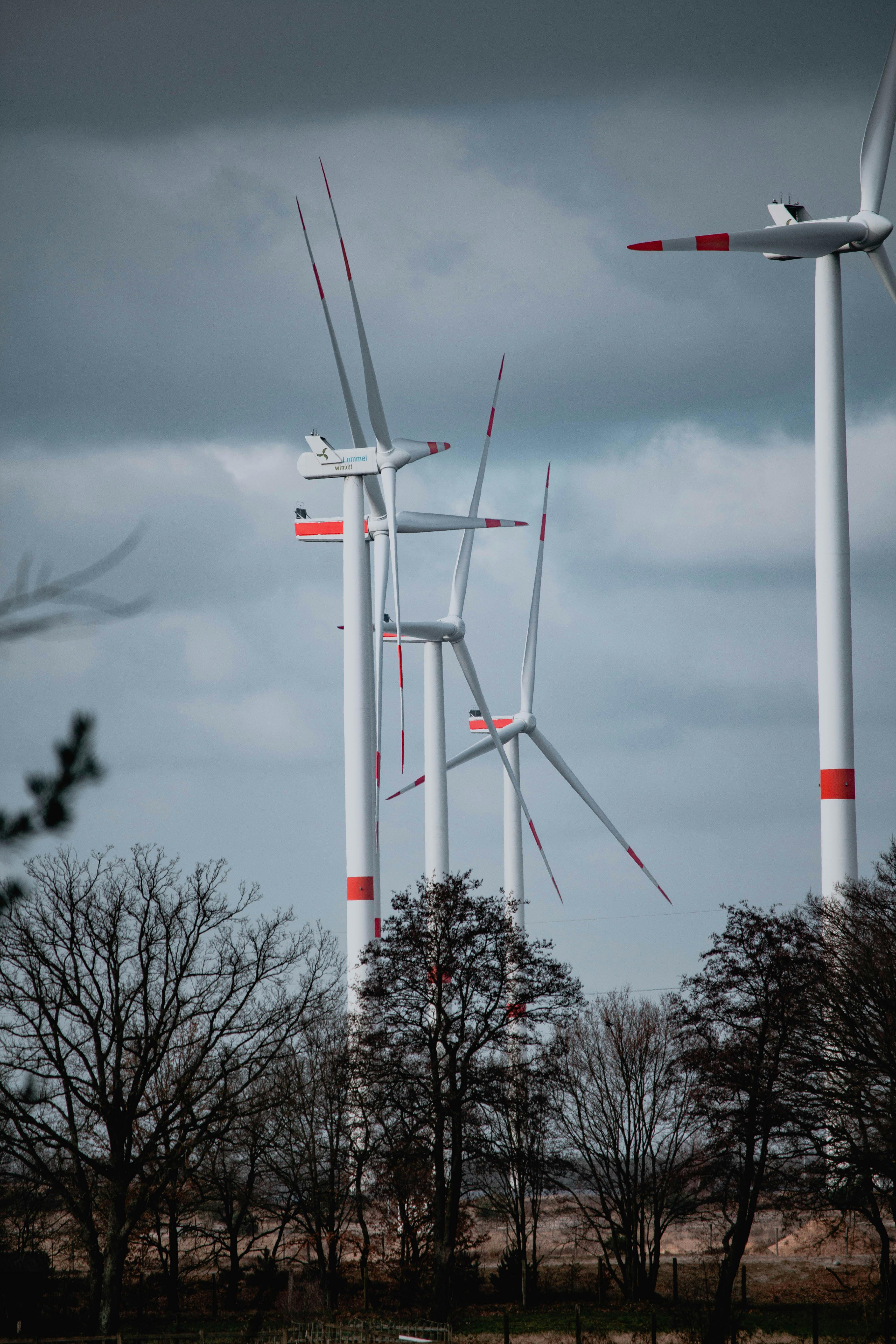 Three Wind Mills Under Cloudy Sky · Free Stock Photo