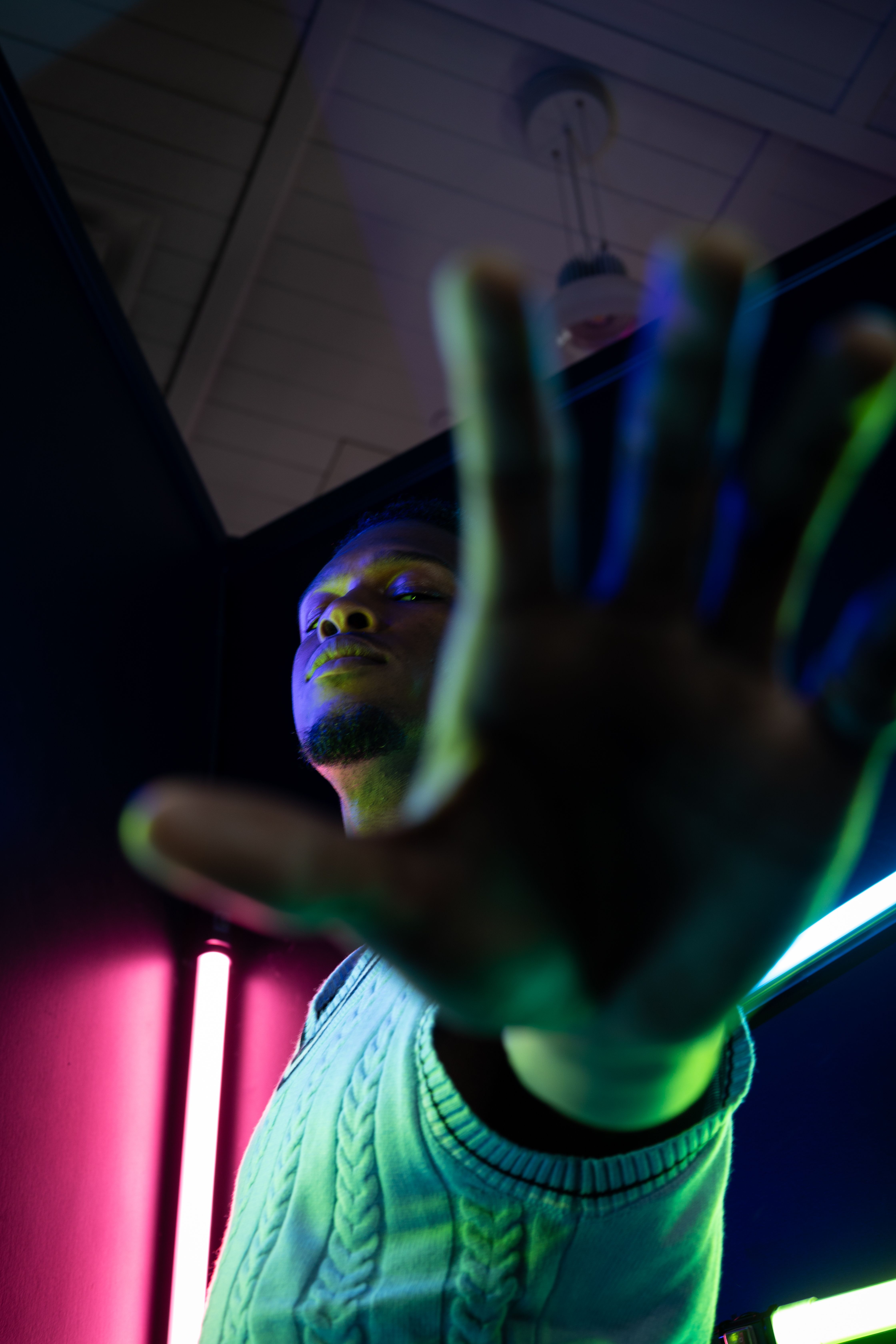 Hand of Man in Green Light · Free Stock Photo