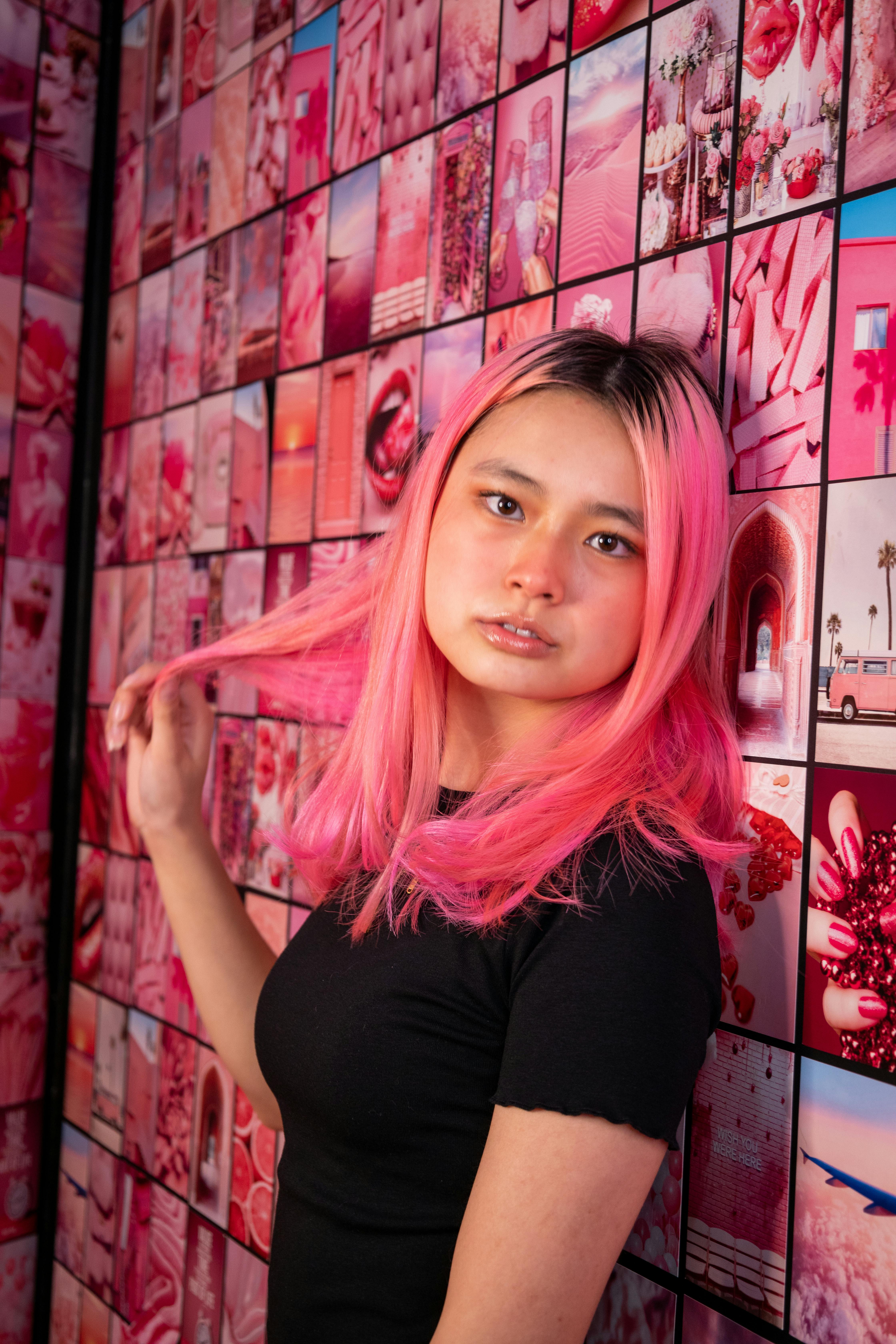 Cute Pink Haired Woman Posing by Wall · Free Stock Photo