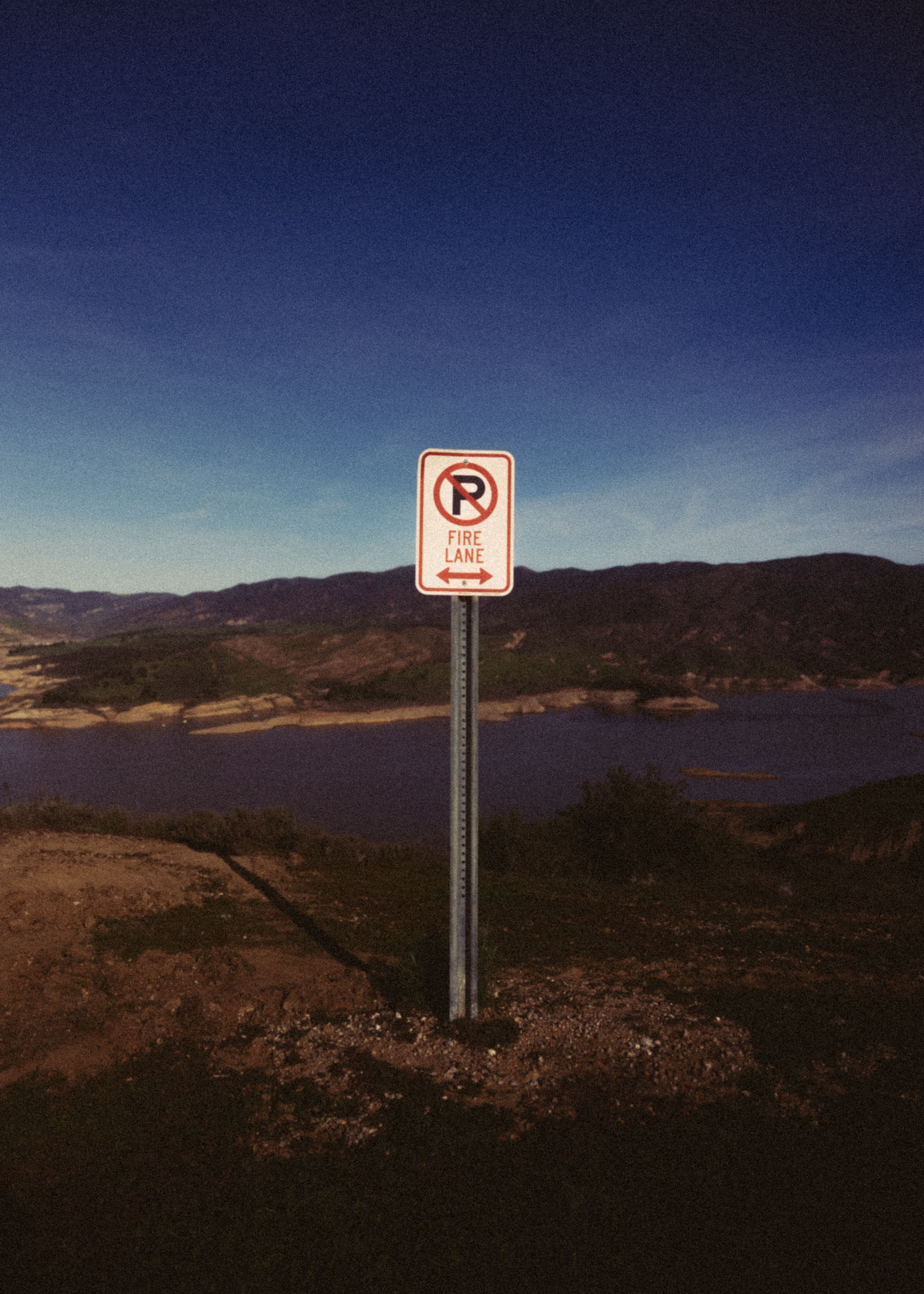 Sign on top of Hill Overlooking Lake · Free Stock Photo