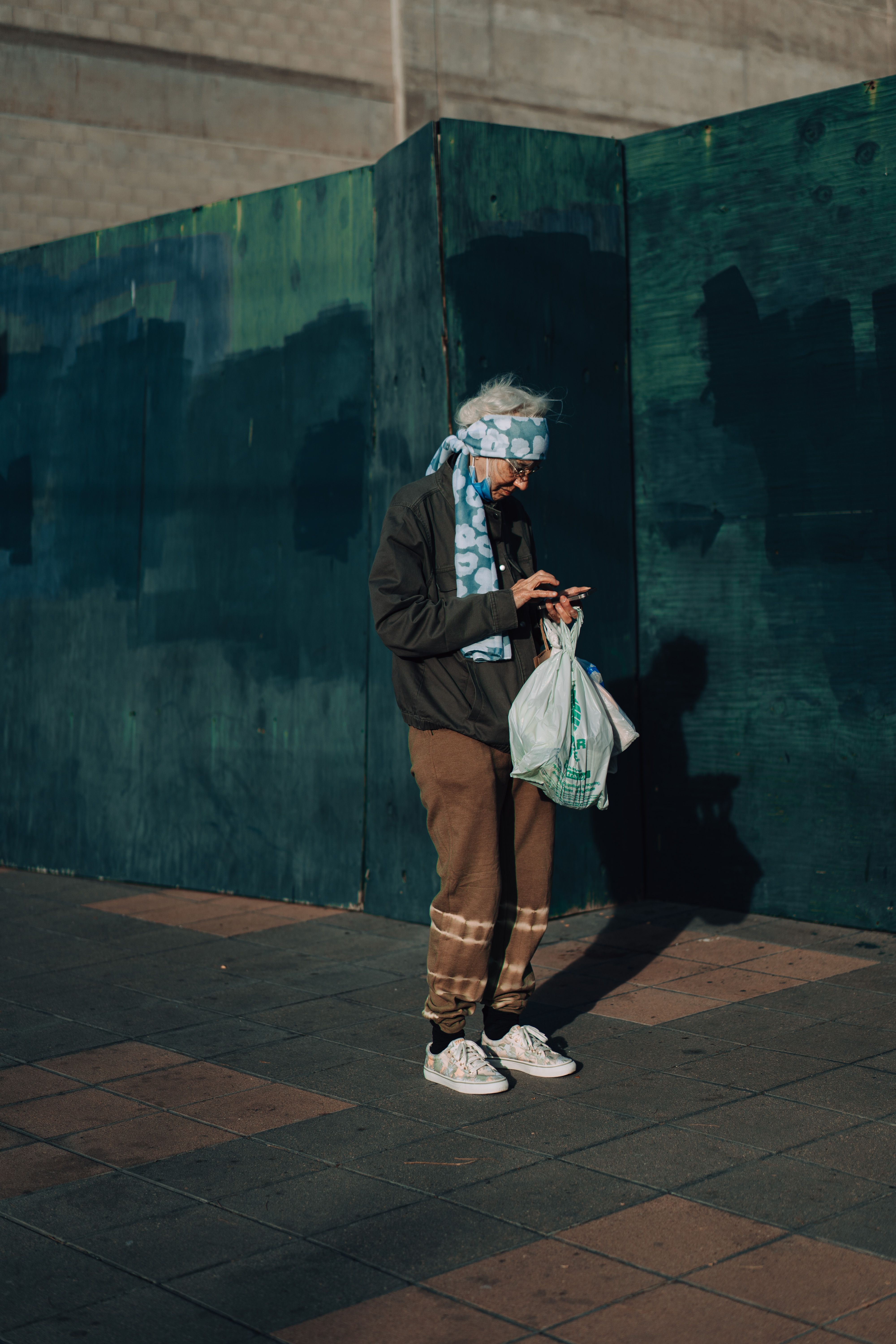 Woman Standing on Pavement · Free Stock Photo