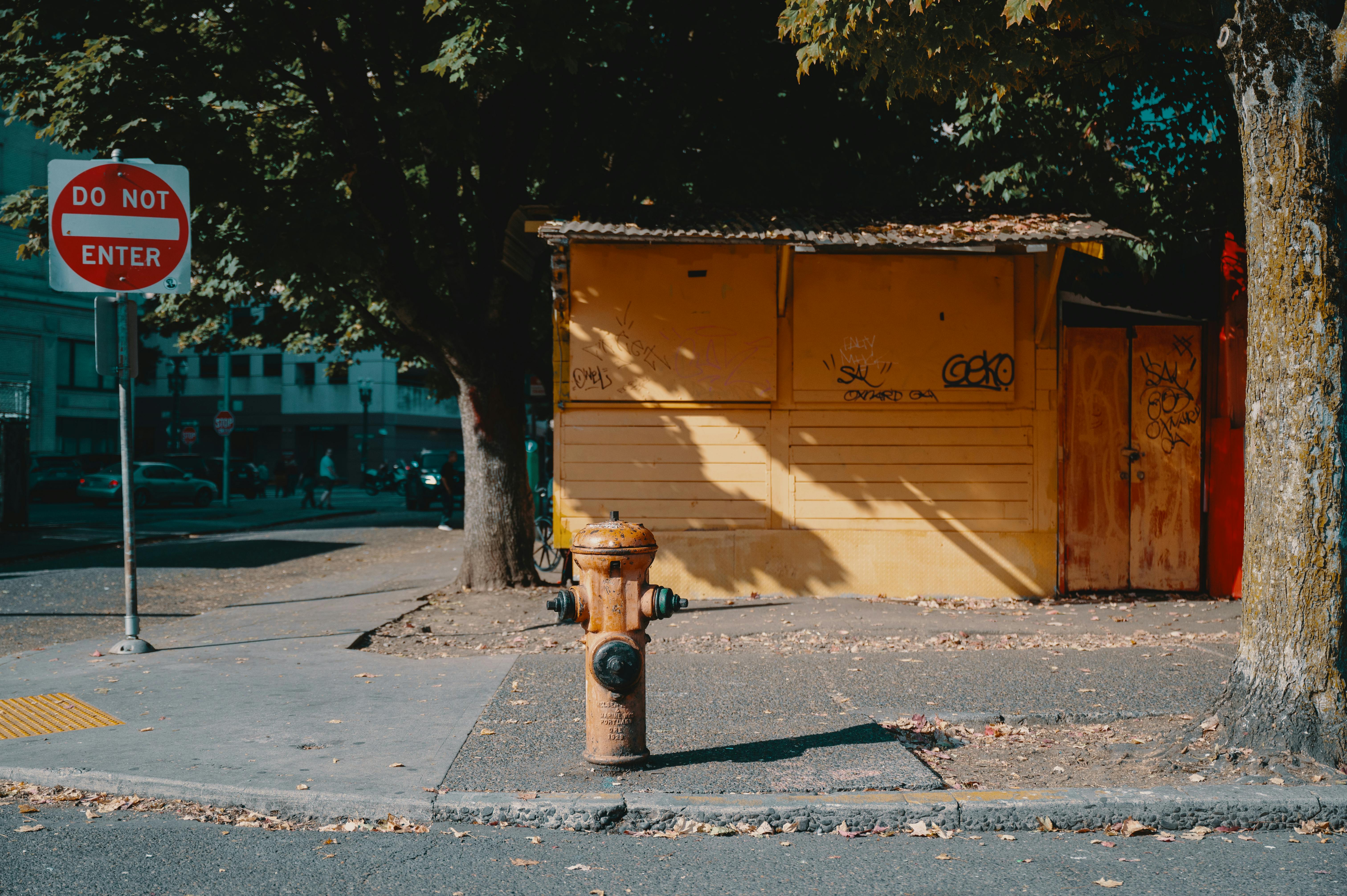 Hydrant near Shed in Town · Free Stock Photo