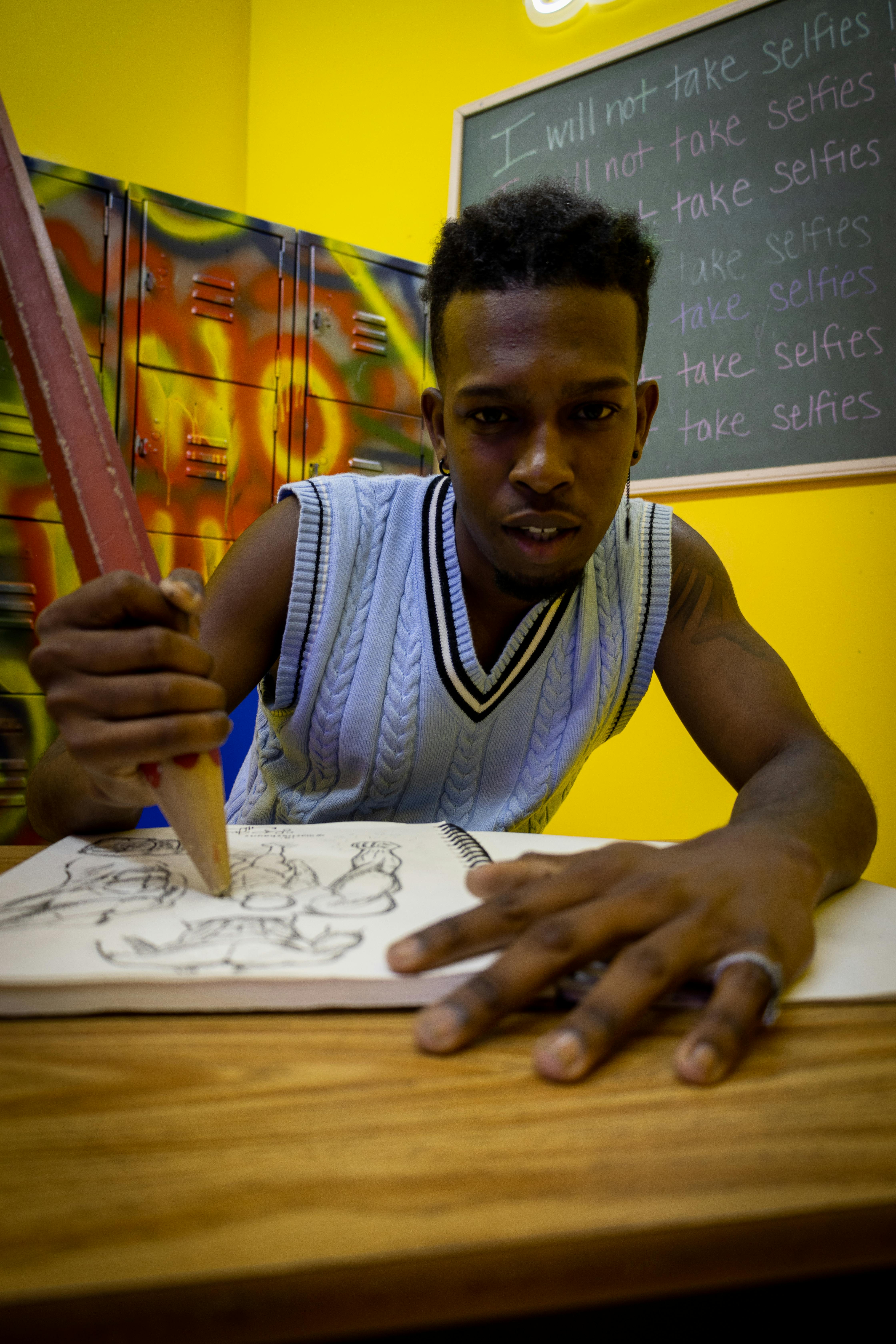 Man Drawing with a Pencil · Free Stock Photo