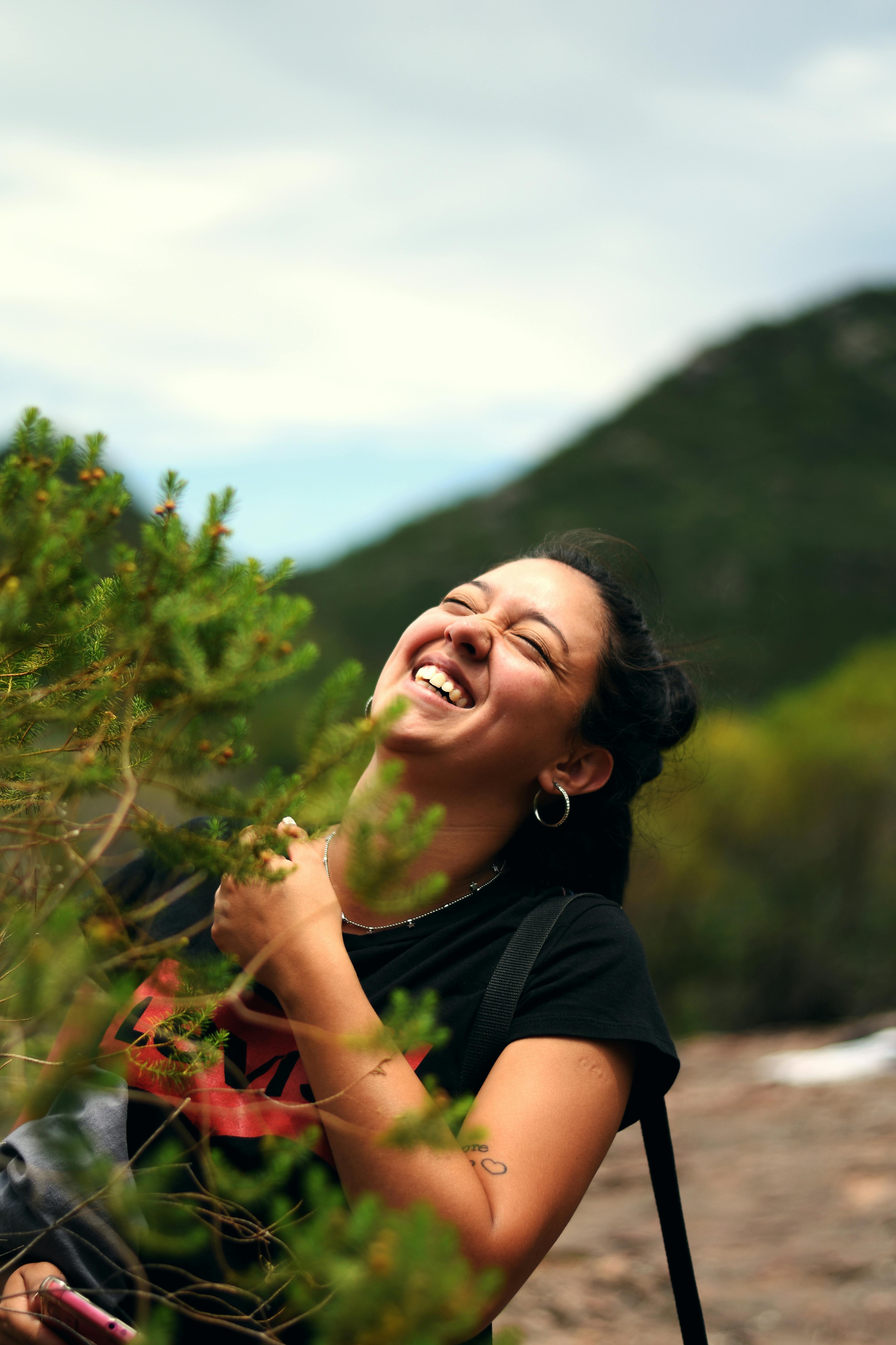 A Woman Standing Beside the Tree · Free Stock Photo