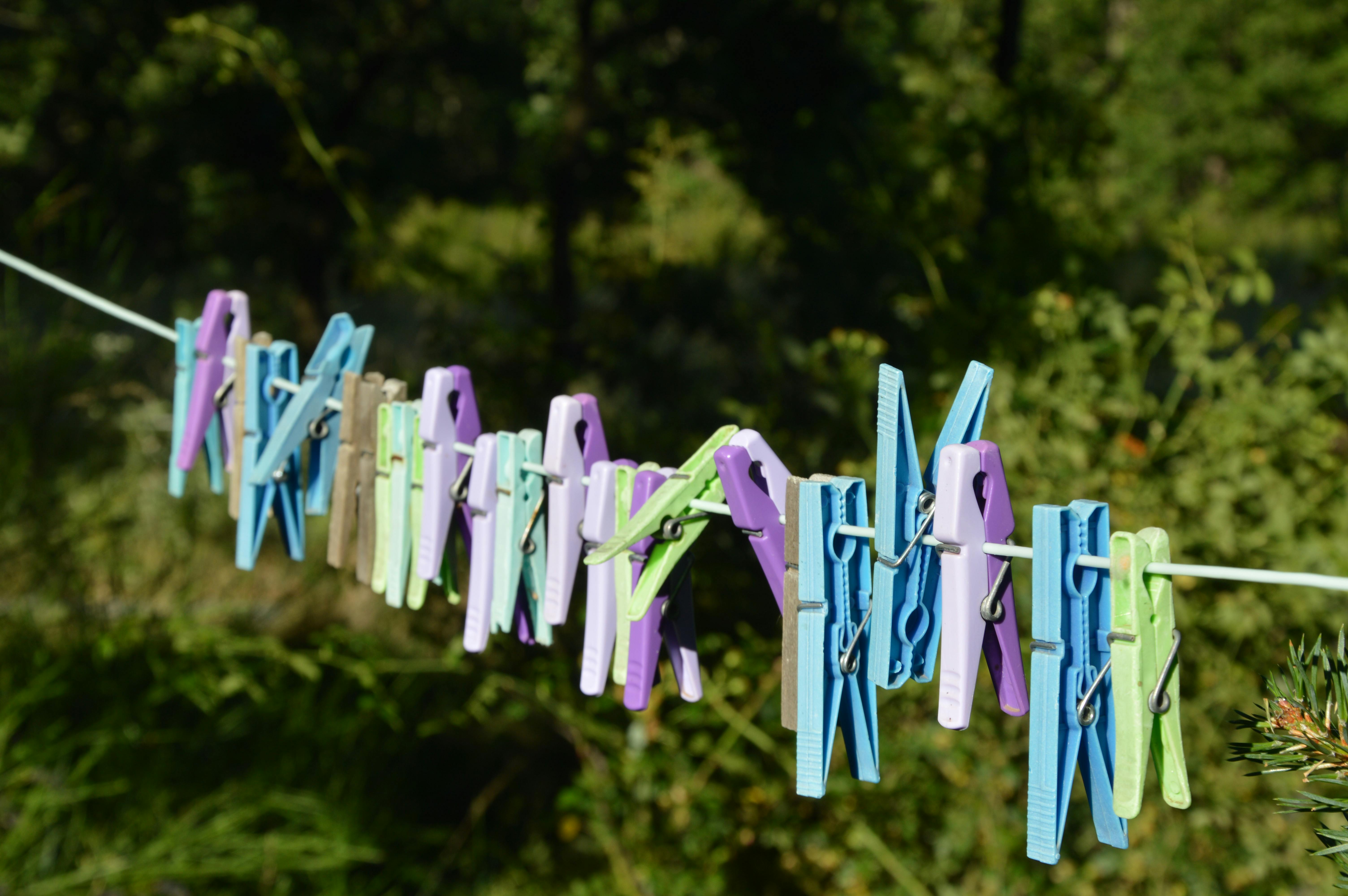 Set of clean linen drying on clothesline in yard · Free Stock Photo