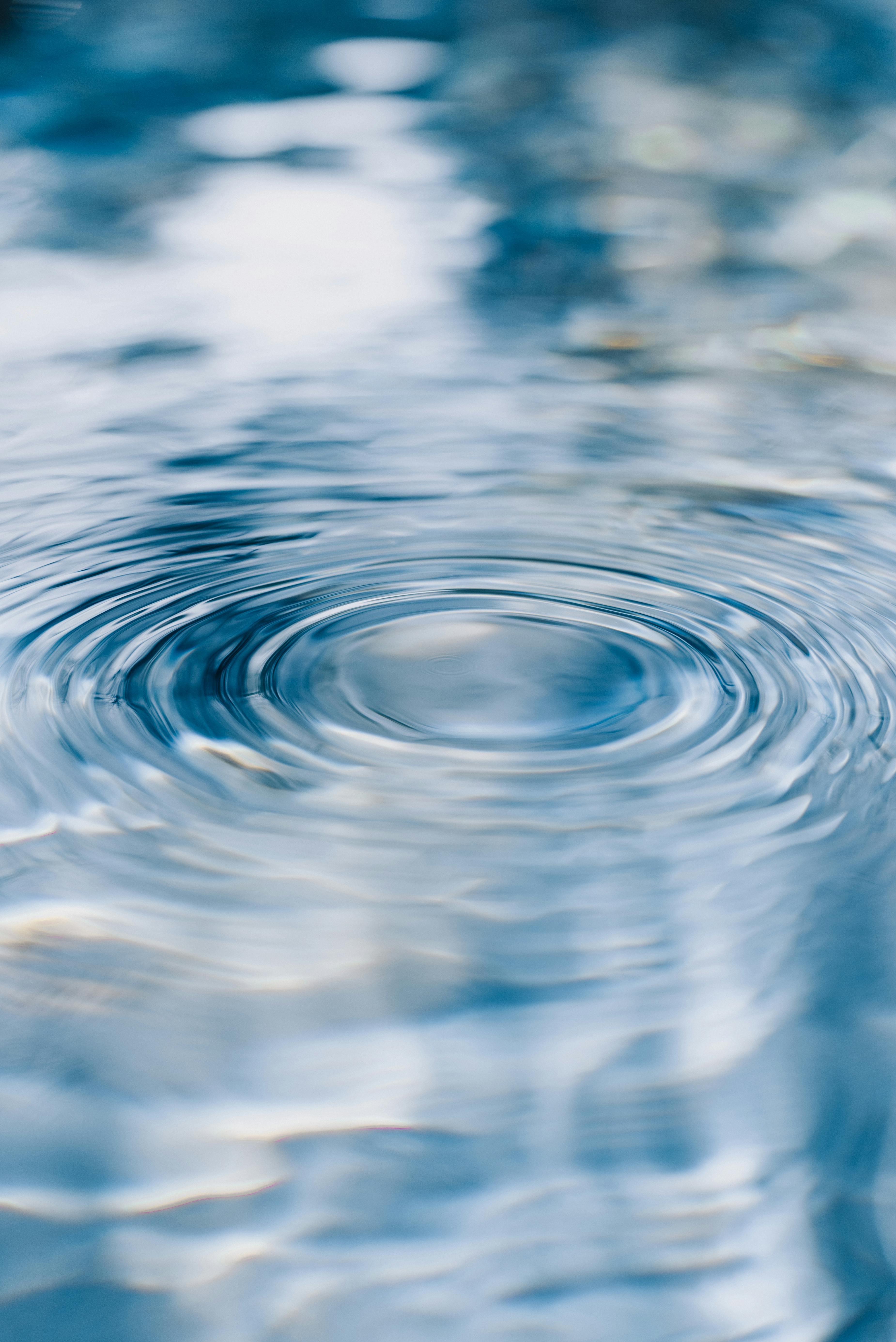 A close up of water ripples with a blue sky · Free Stock Photo