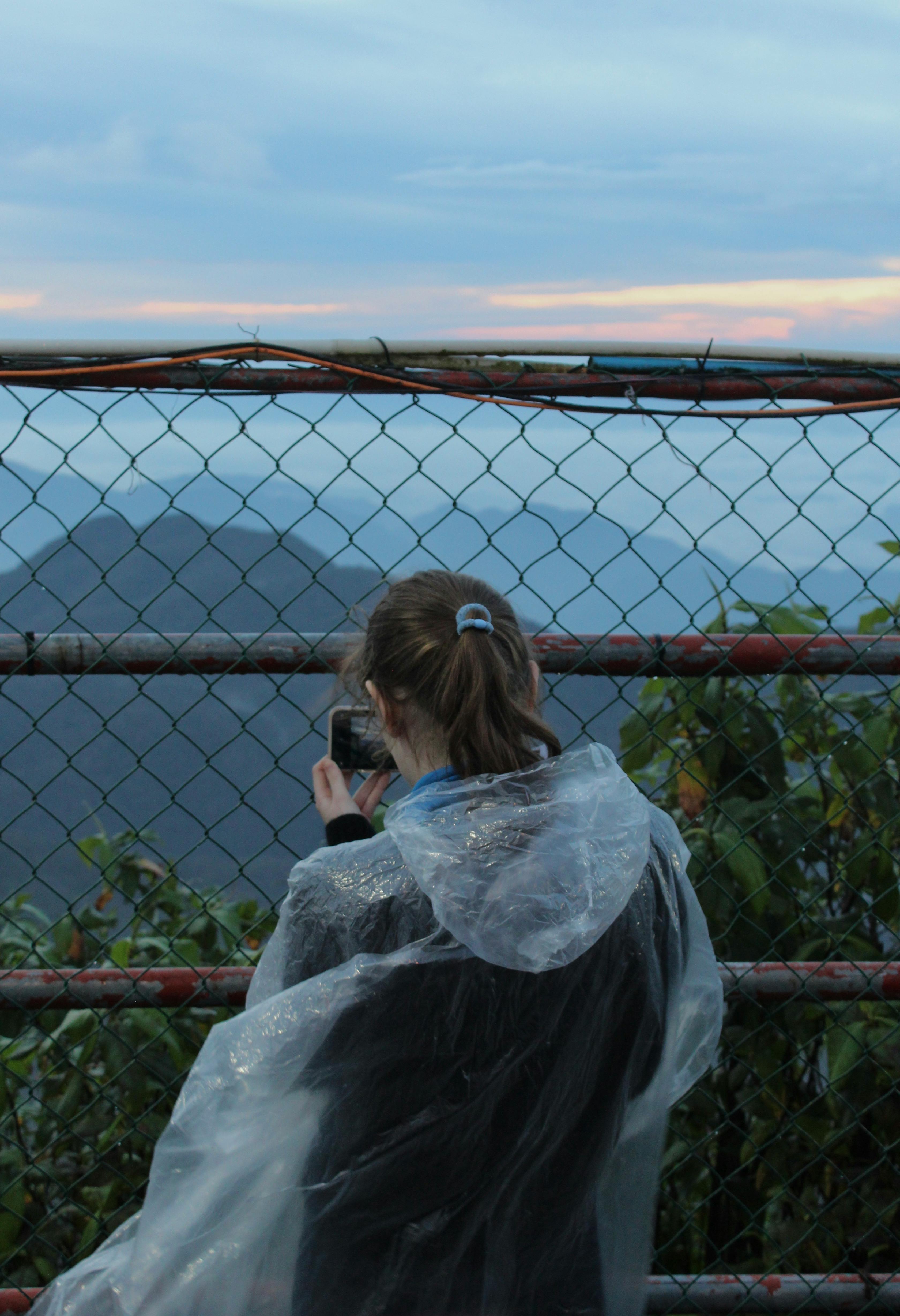 Back View of a Woman Photographing the Landscape · Free Stock Photo