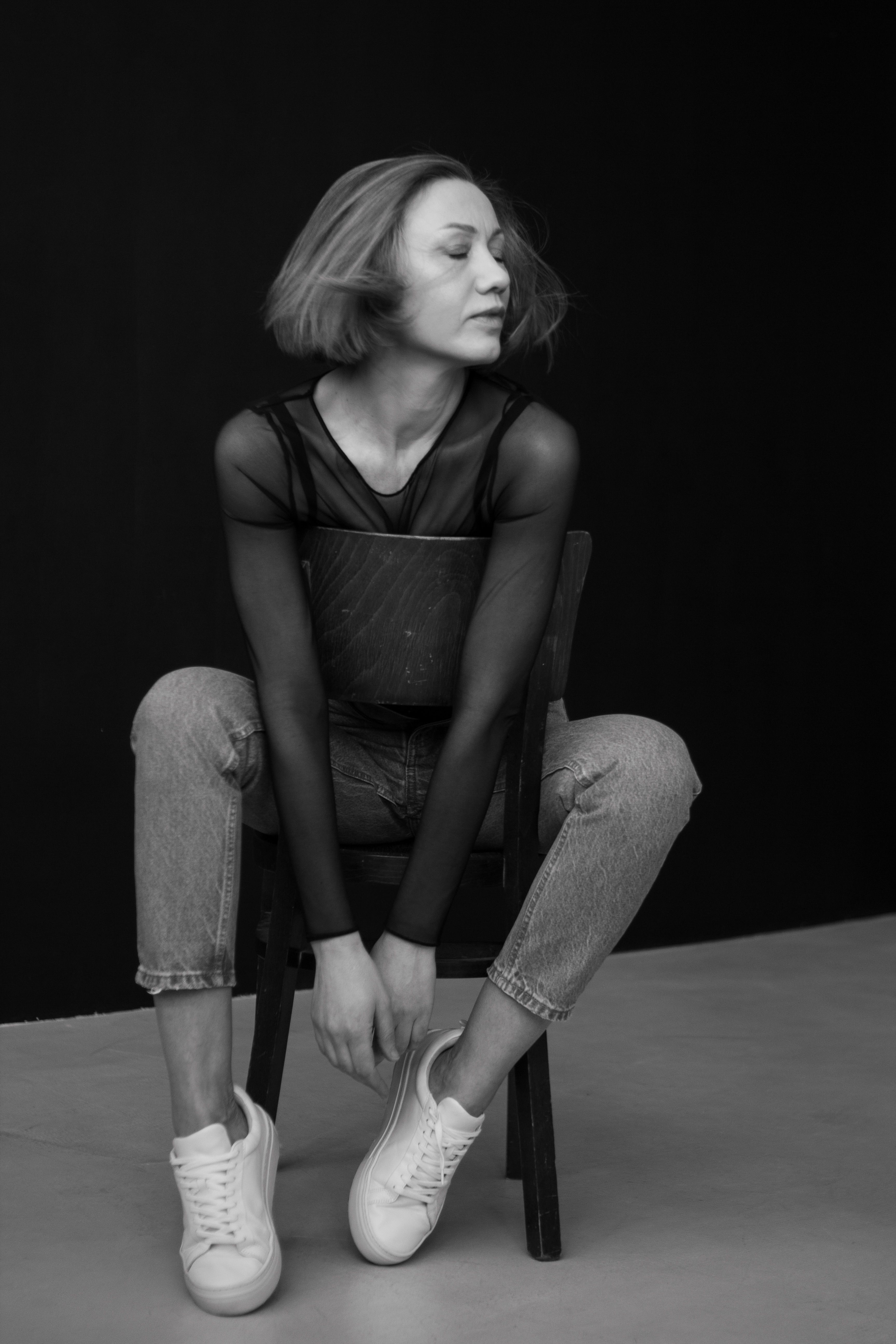 Woman Sitting on a Chair Backwards · Free Stock Photo