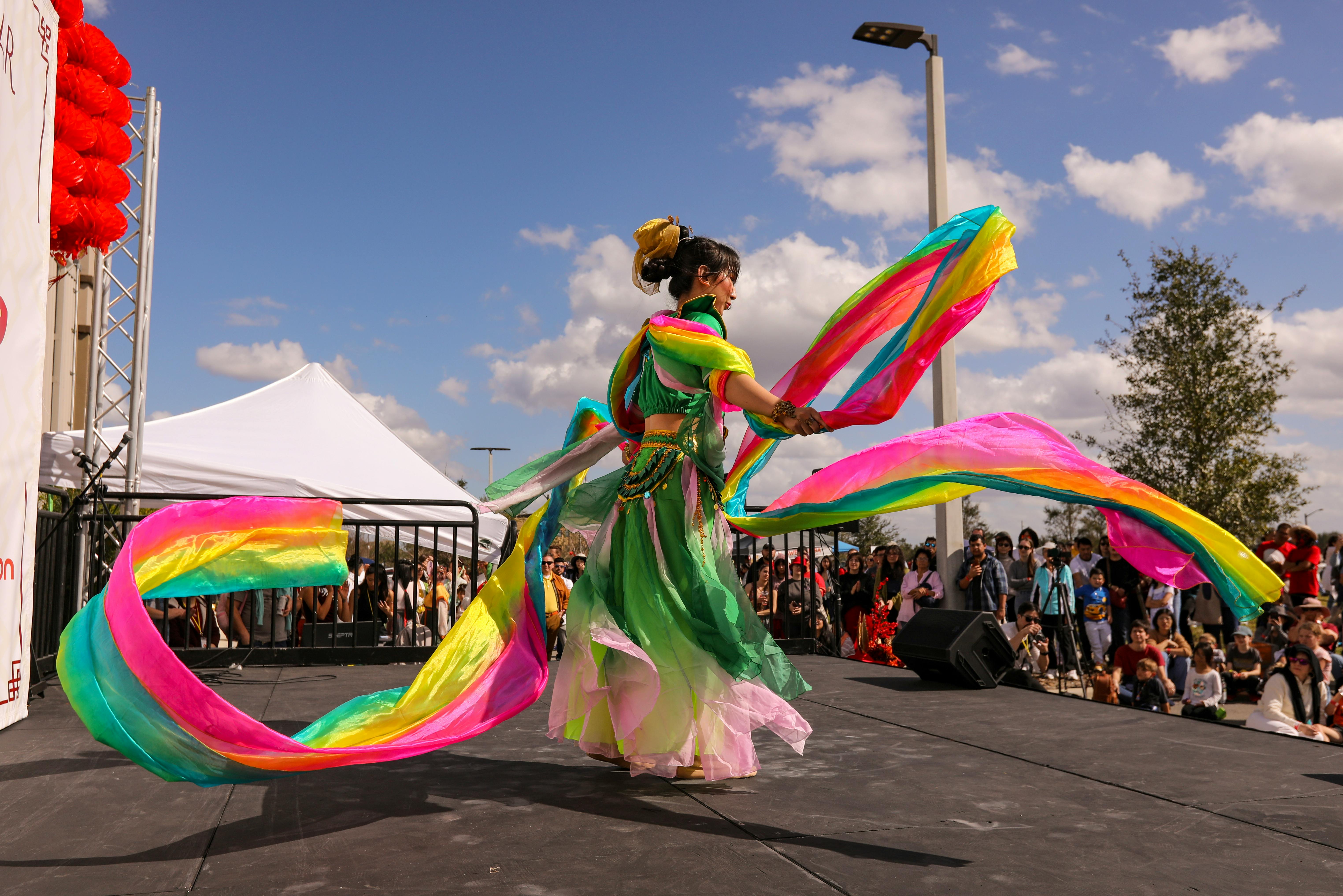 Dancer in Multi Colored Dress · Free Stock Photo