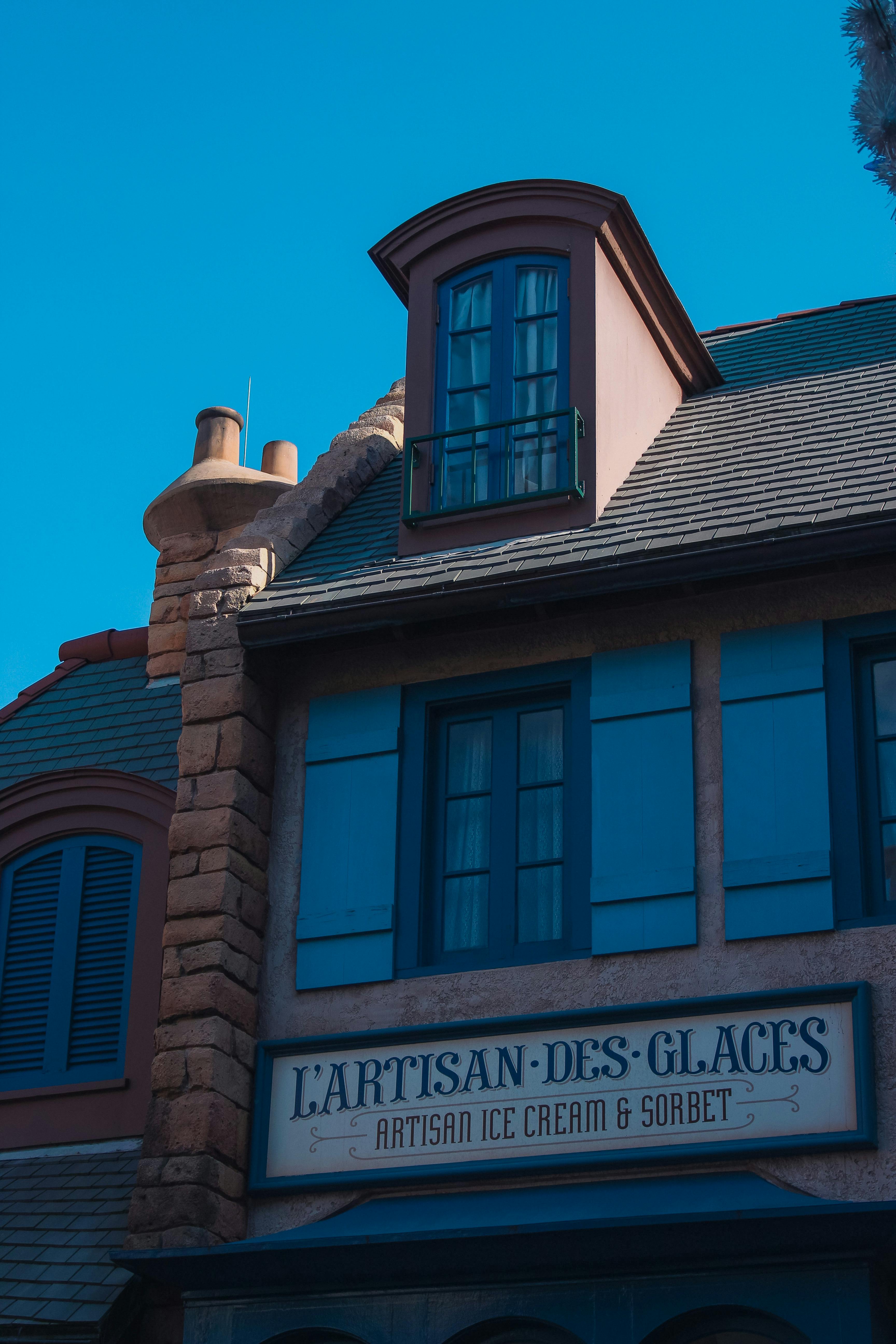 Retro Sign on Traditional Old Building · Free Stock Photo
