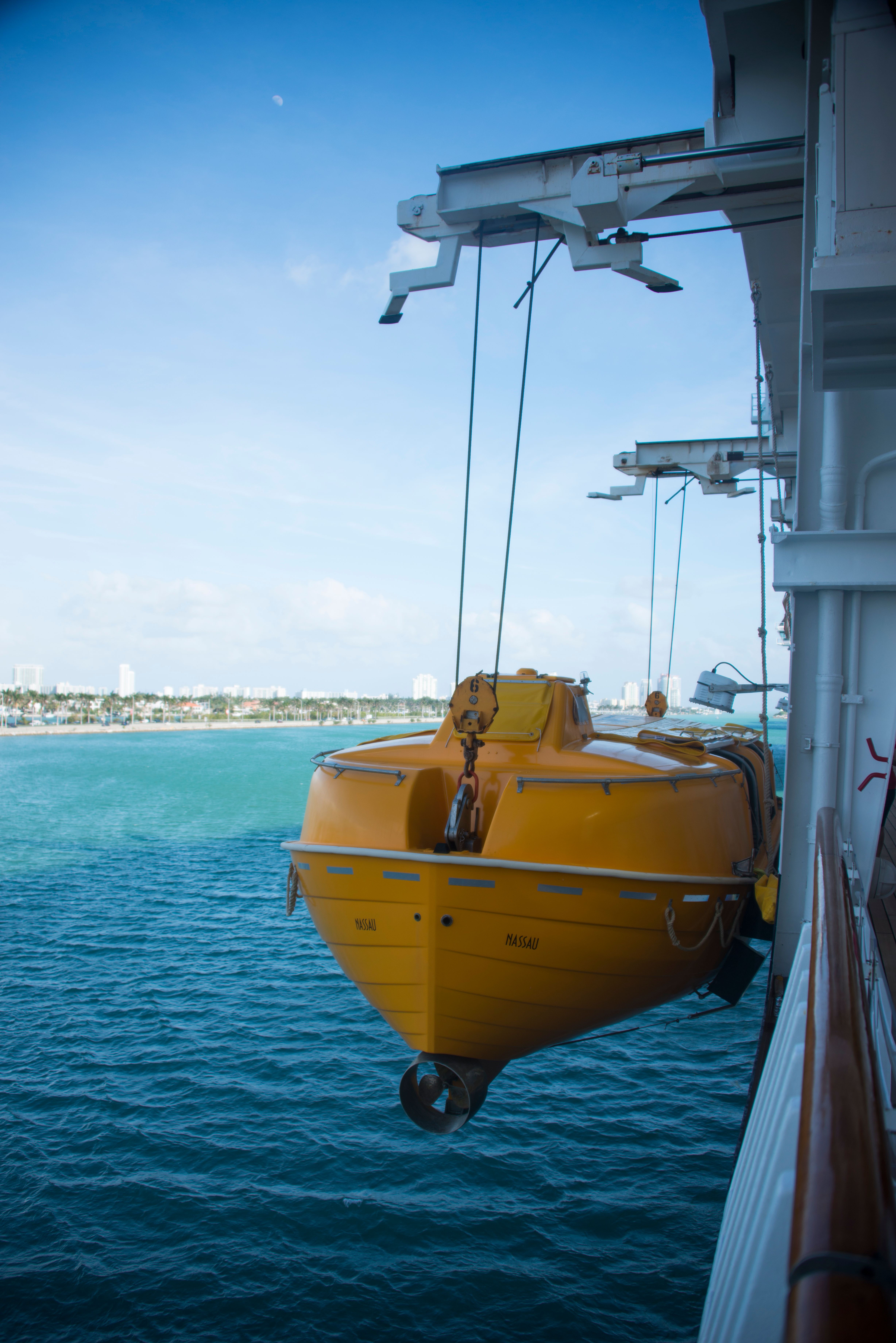 Sunlit Cruise Ship Deck with Lifeboats · Free Stock Photo