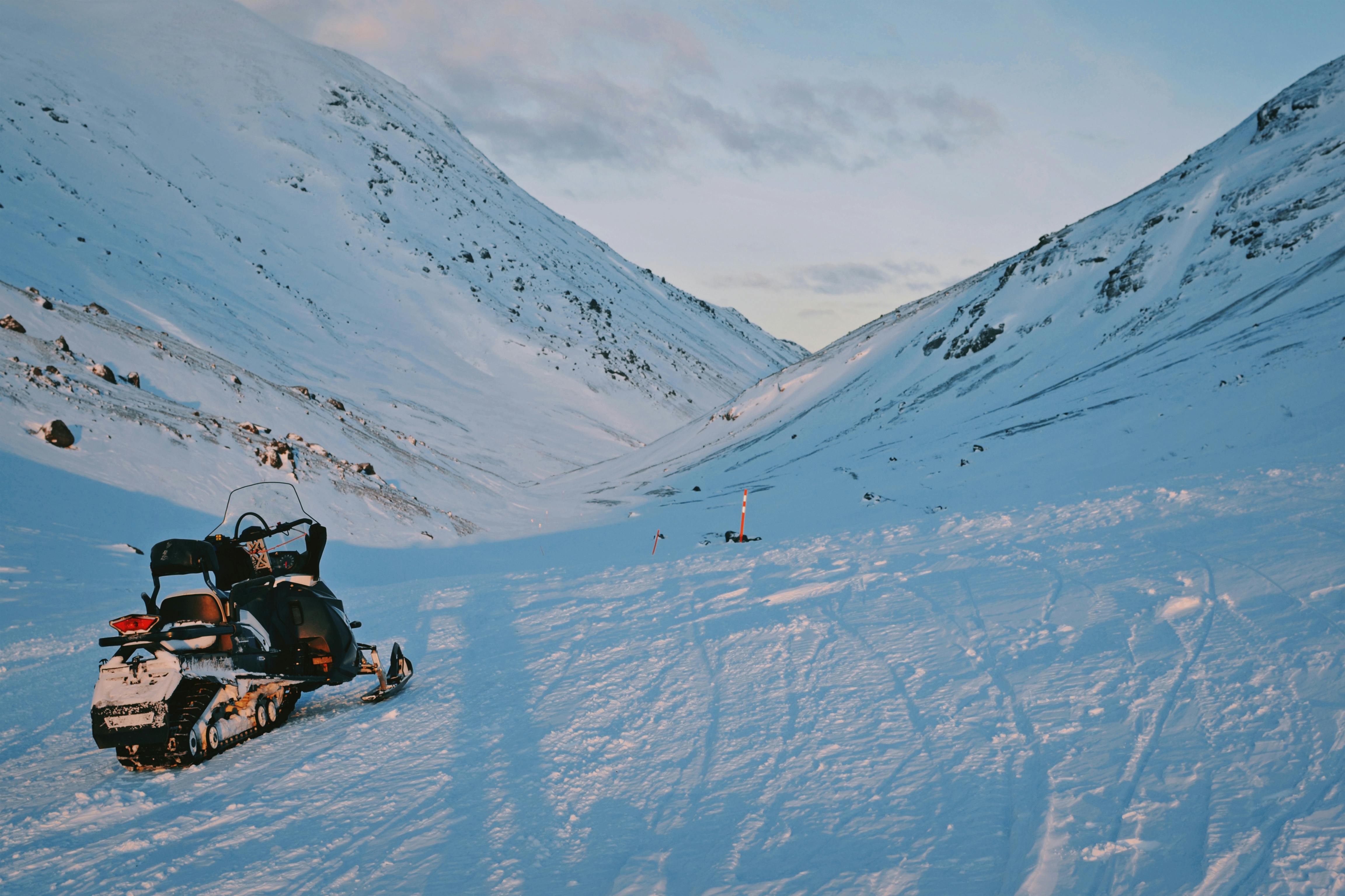 Person Riding a Snowmobile · Free Stock Photo