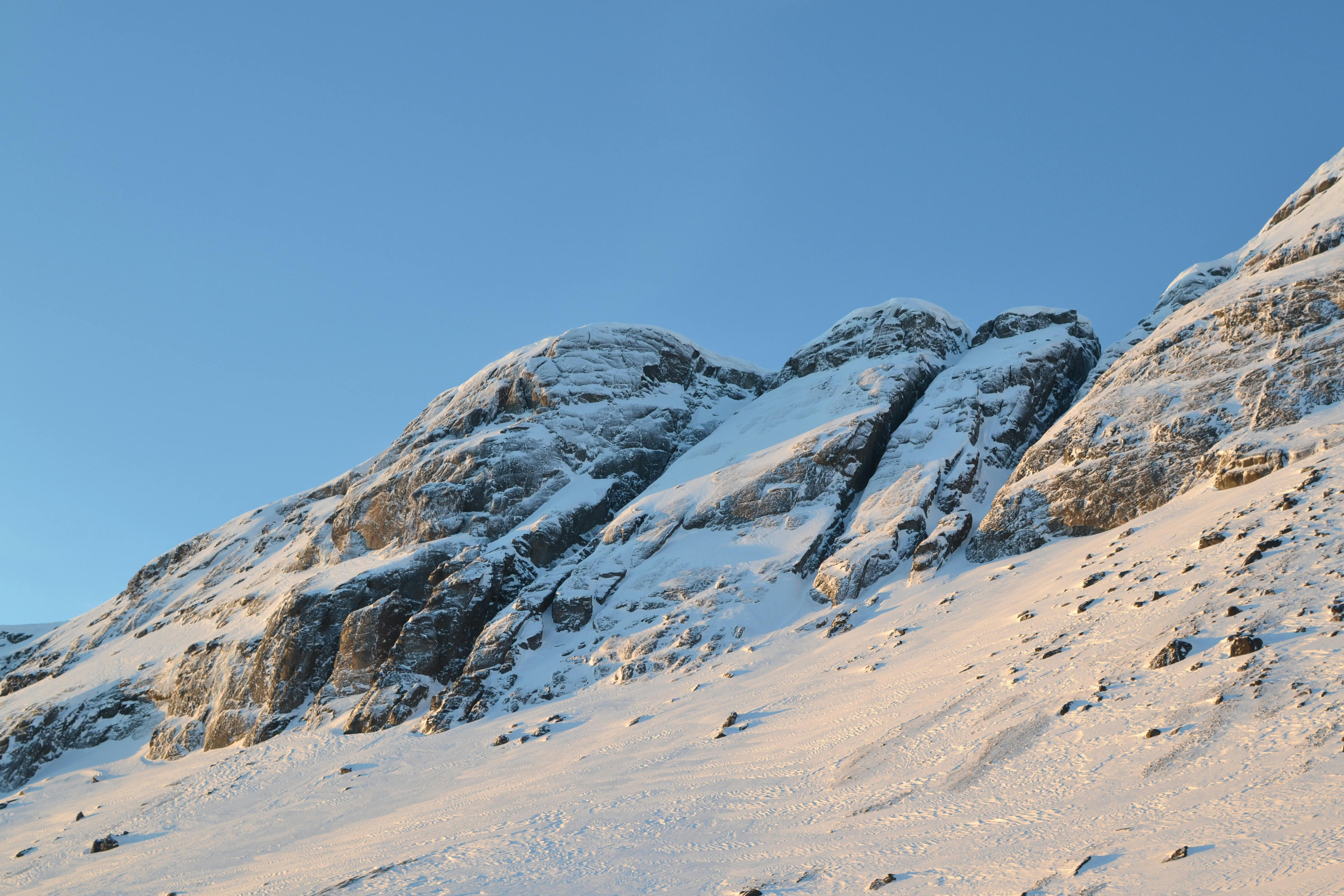 Snow on Craggy Rock Formation · Free Stock Photo