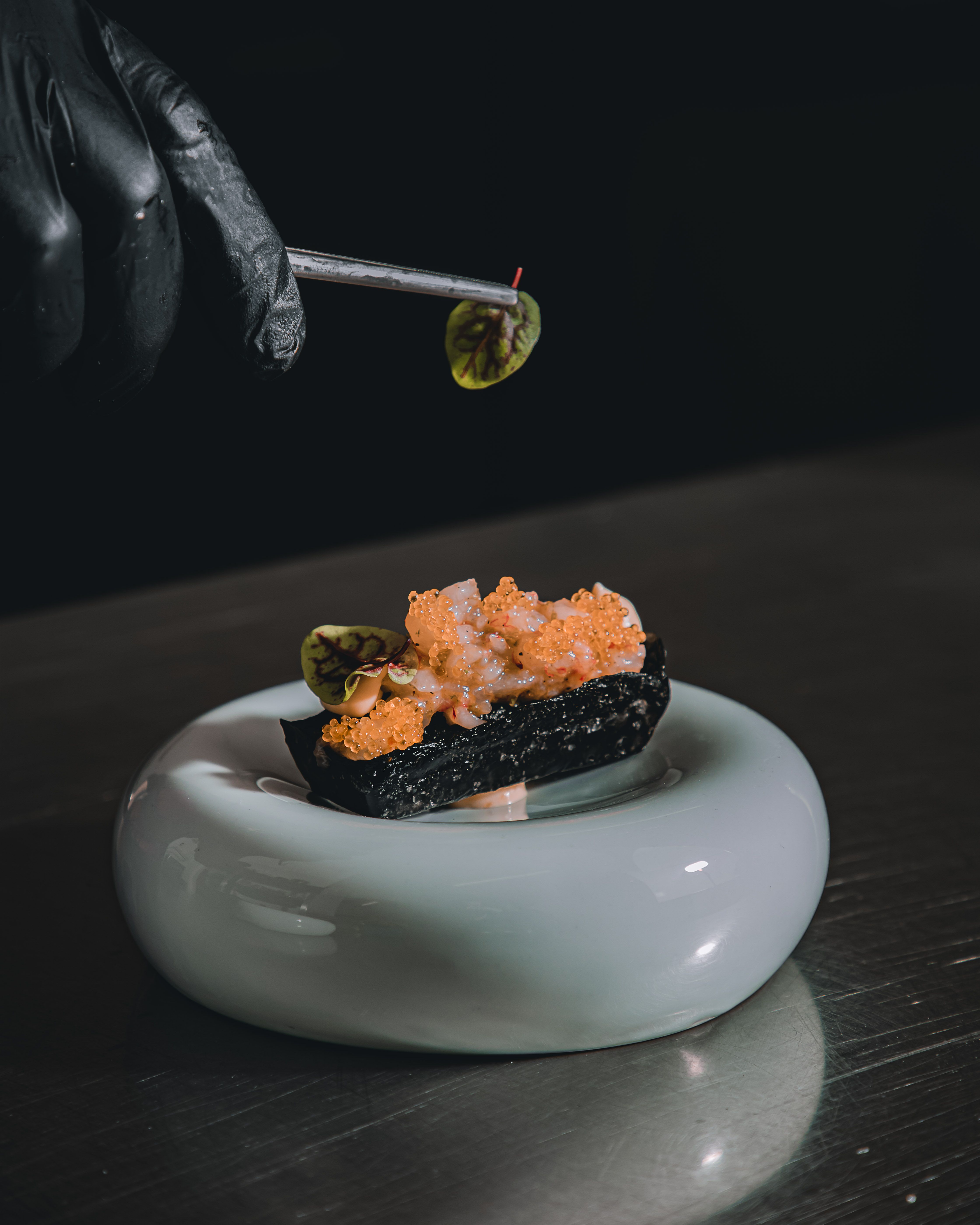 Chef Preparing an Exclusive Dish of Shrimp and Caviar · Free Stock Photo