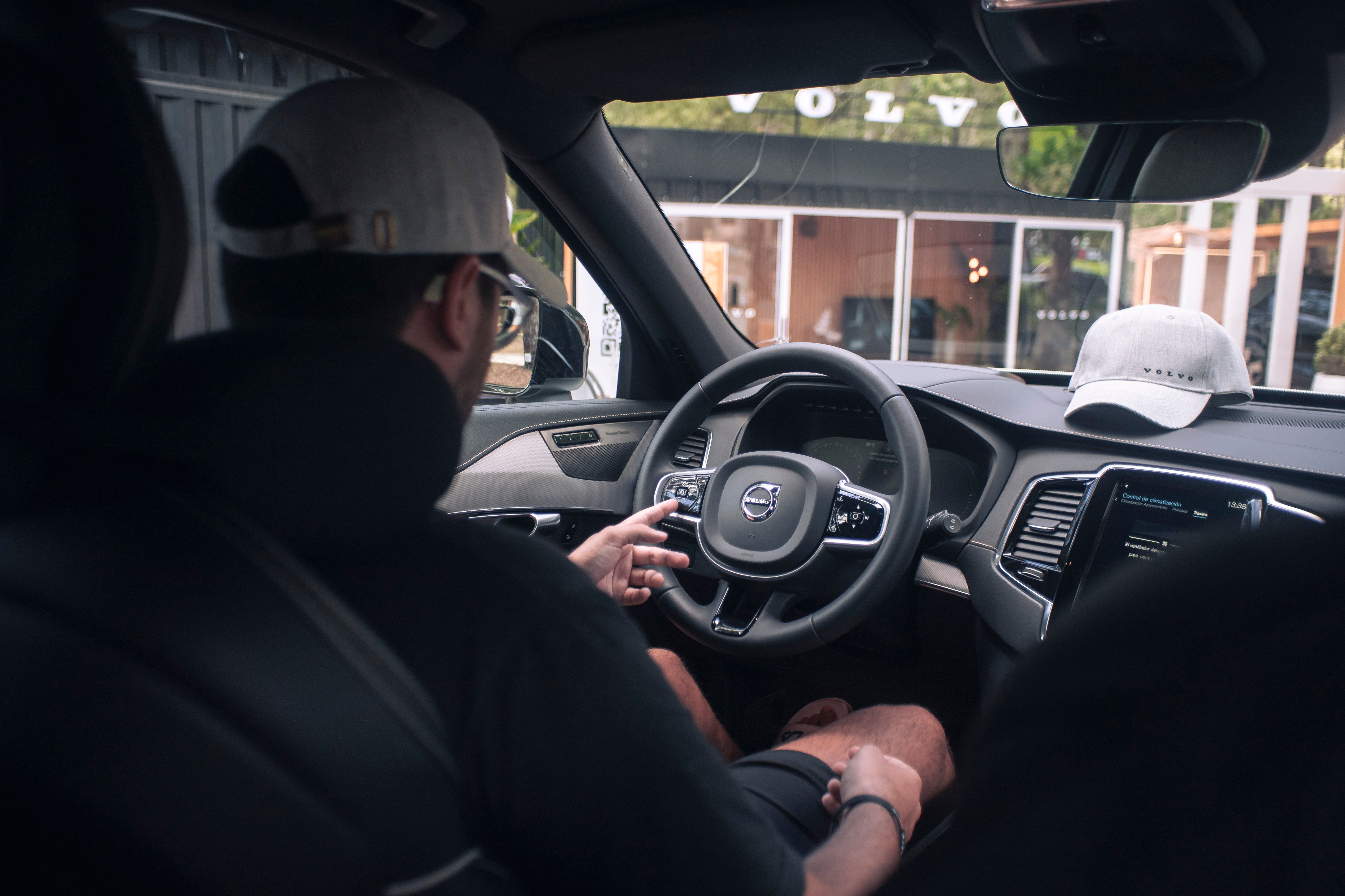 Man Wearing Cap Driving Car · Free Stock Photo
