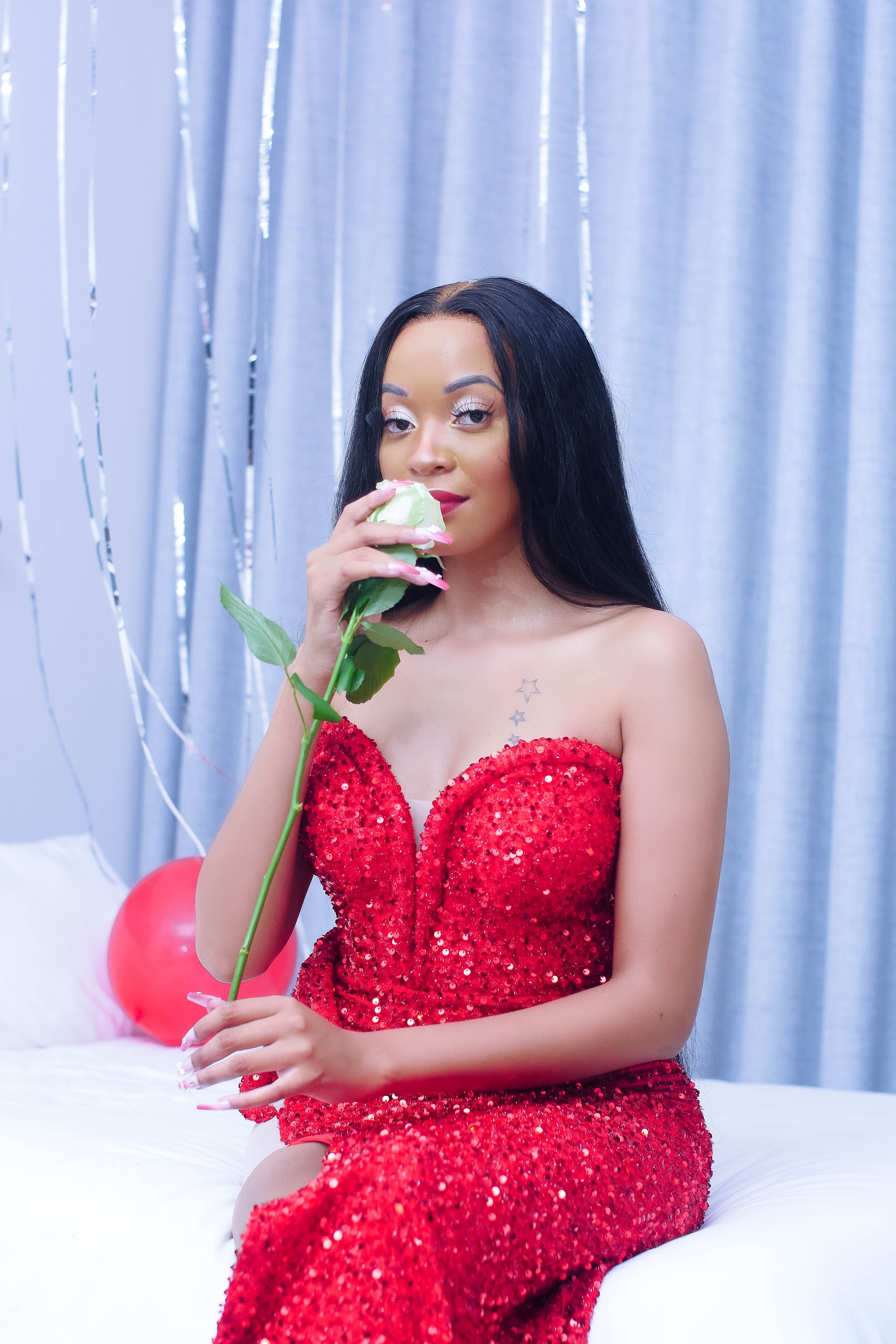 Woman in Glistening Red Dress · Free Stock Photo