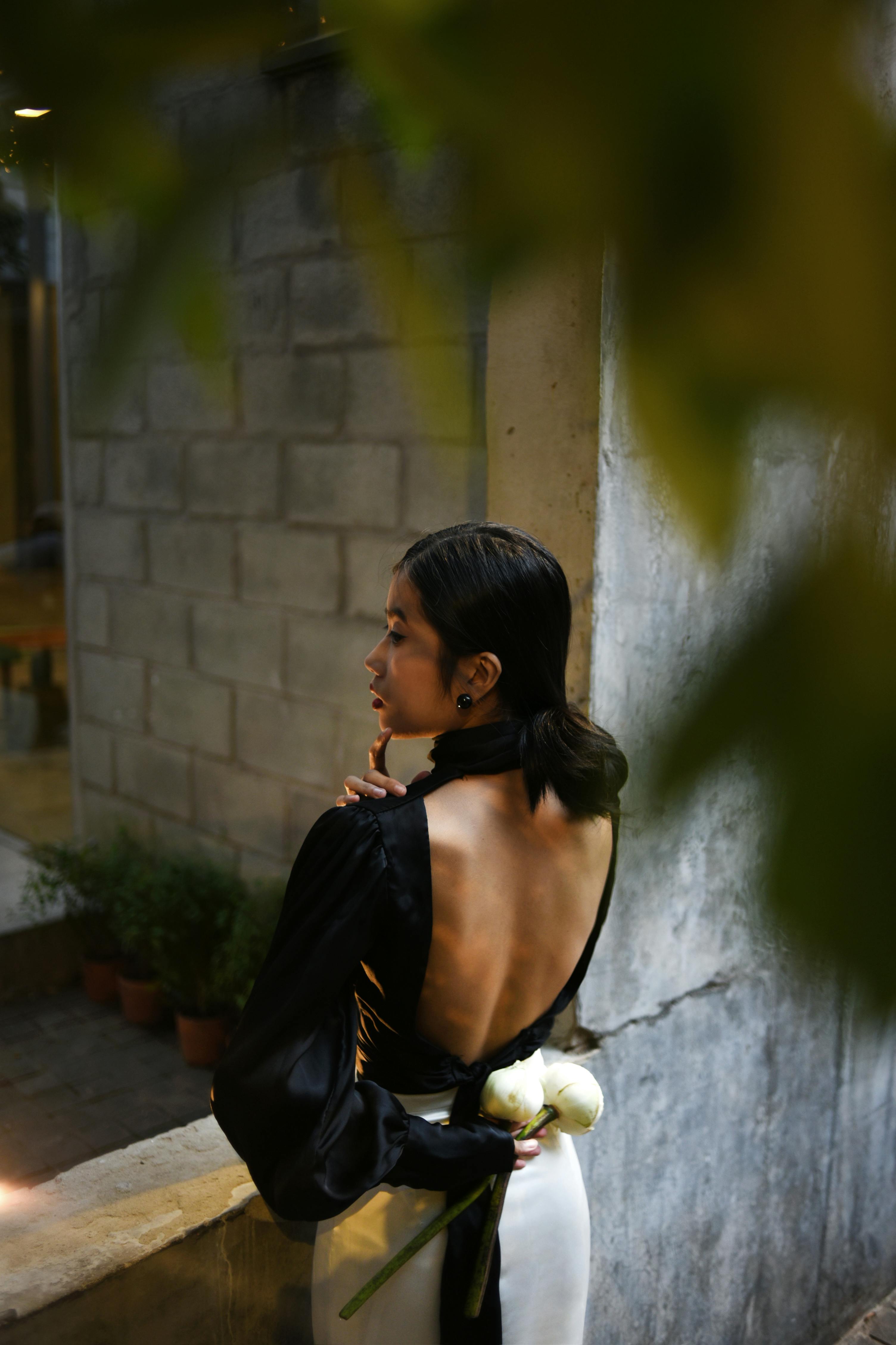 Woman Holding Flower behind Back · Free Stock Photo