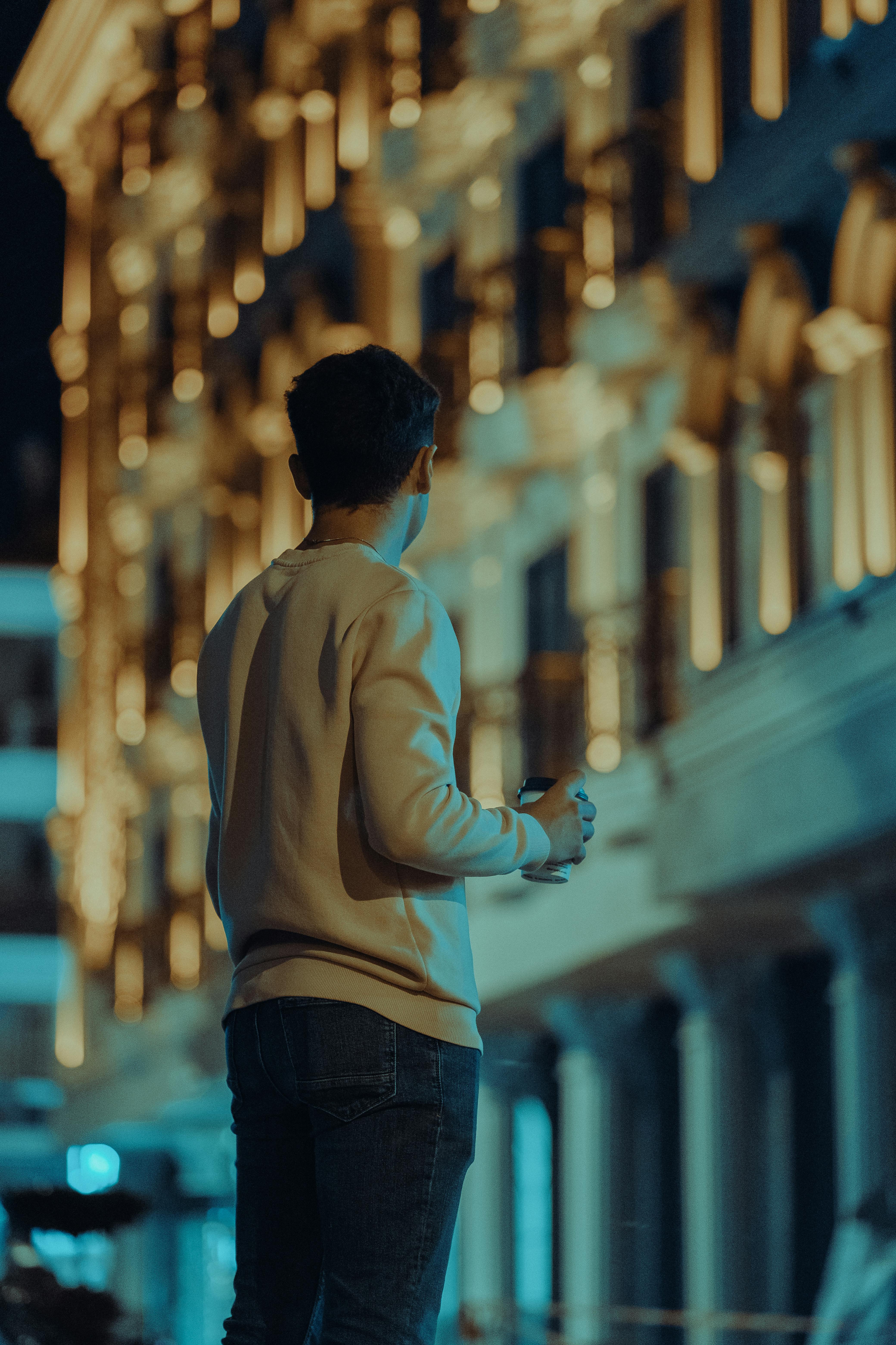 Man Standing near Building at Night · Free Stock Photo