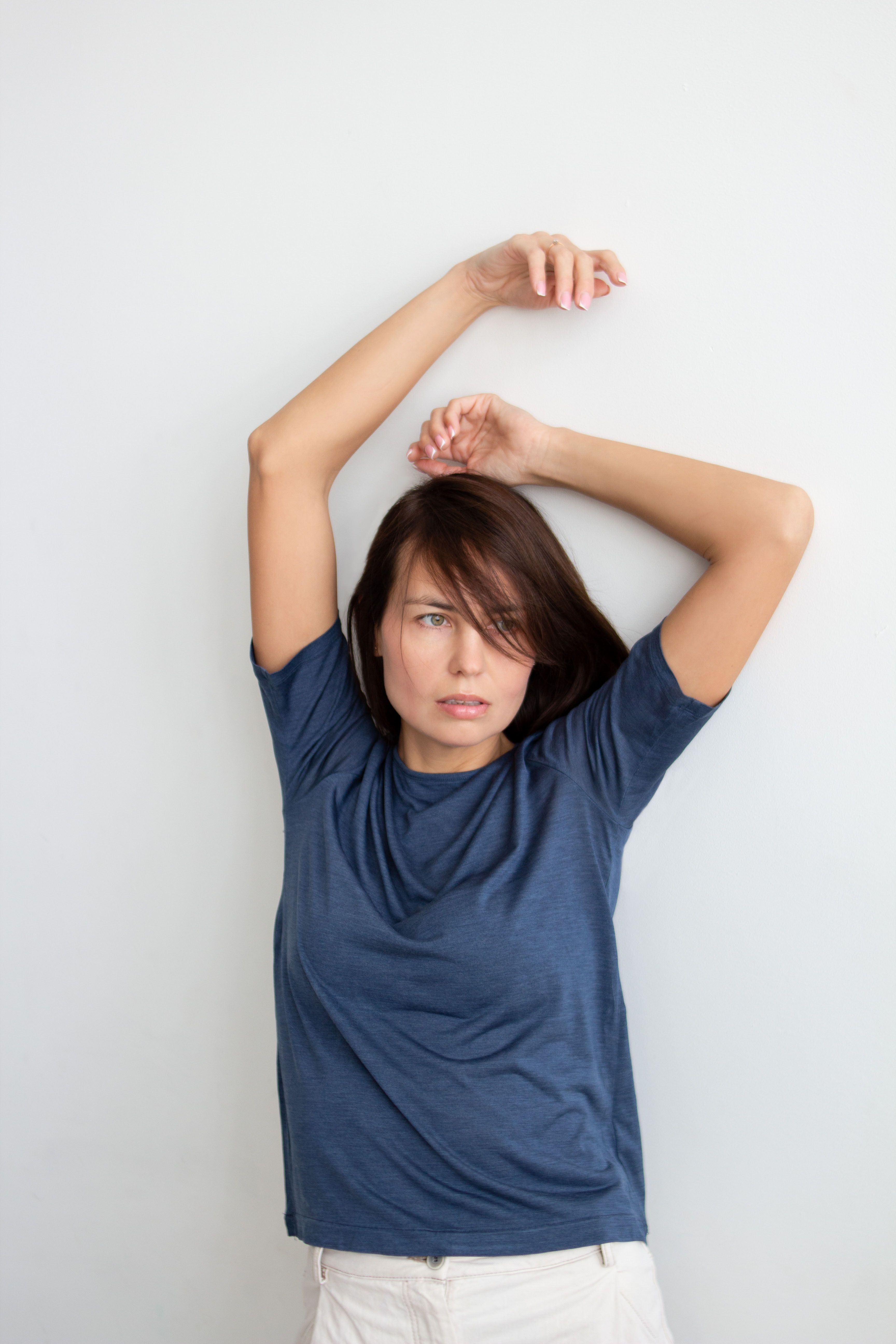 Woman Posing on White Background · Free Stock Photo