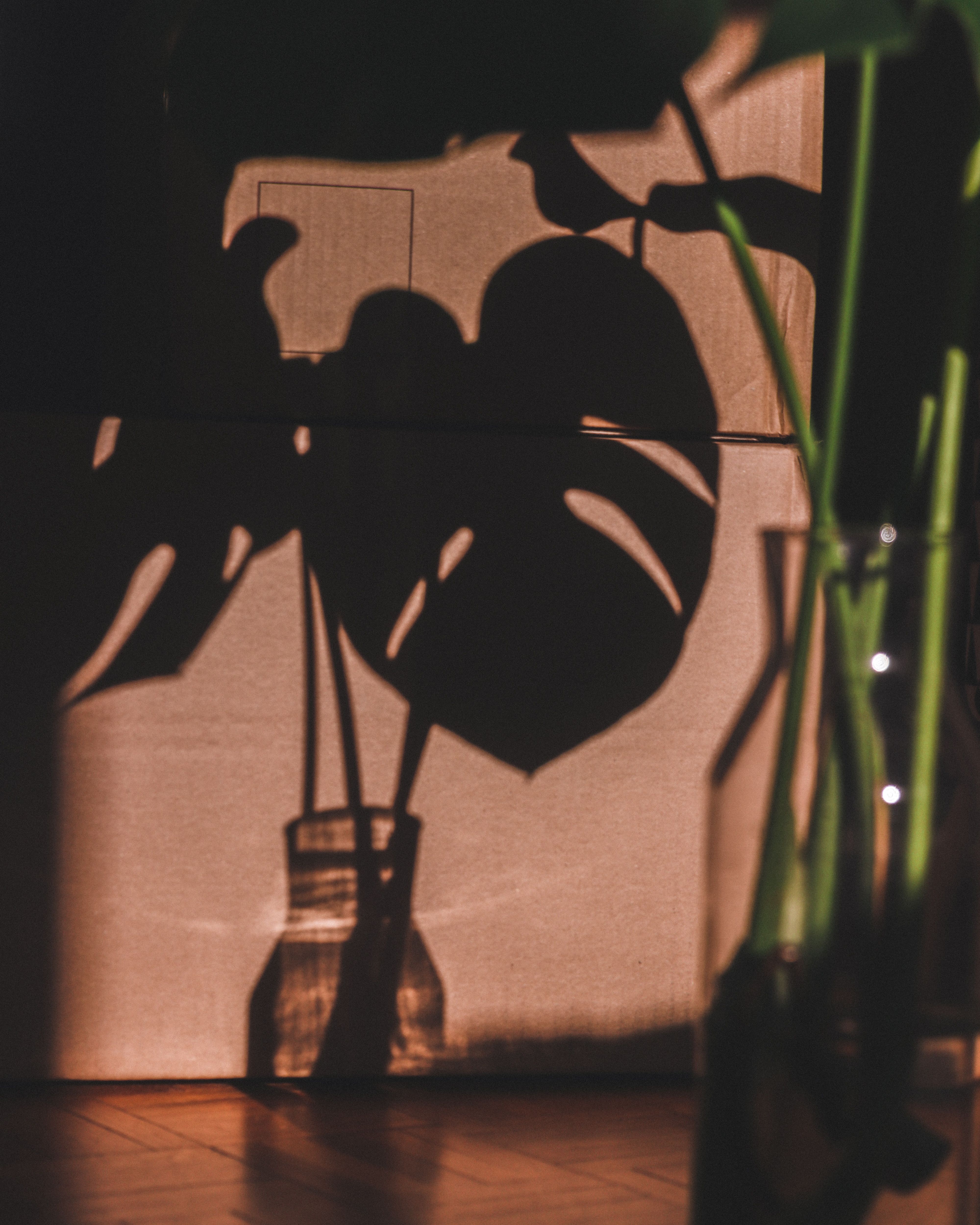 A Candle and Glass Vase Reflection on a Standing Mirror · Free Stock Photo