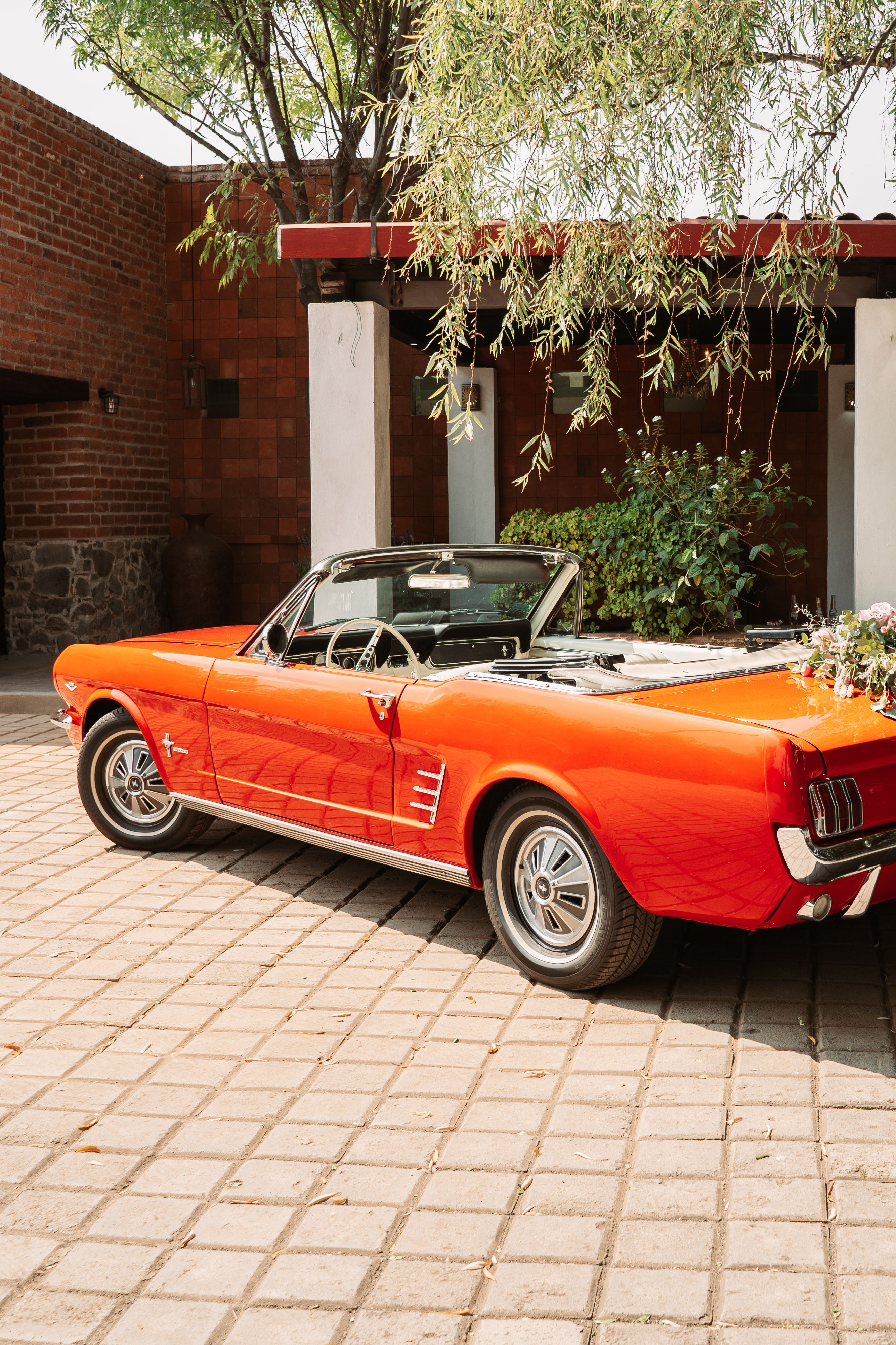 Red Cabriolet Car with Flowers Arrangement · Free Stock Photo