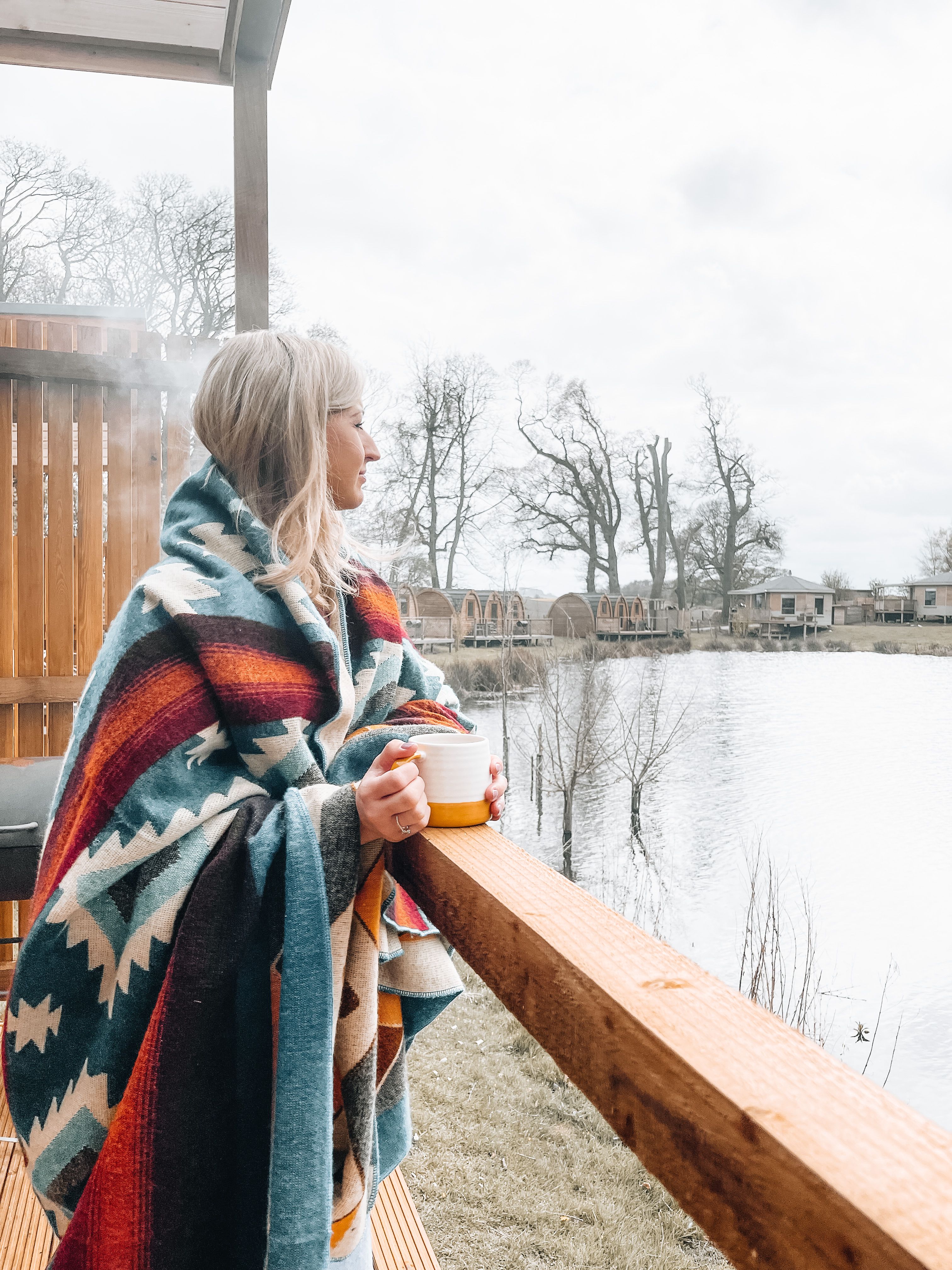 Standing Woman on Vacation Holding a Hot Mug · Free Stock Photo