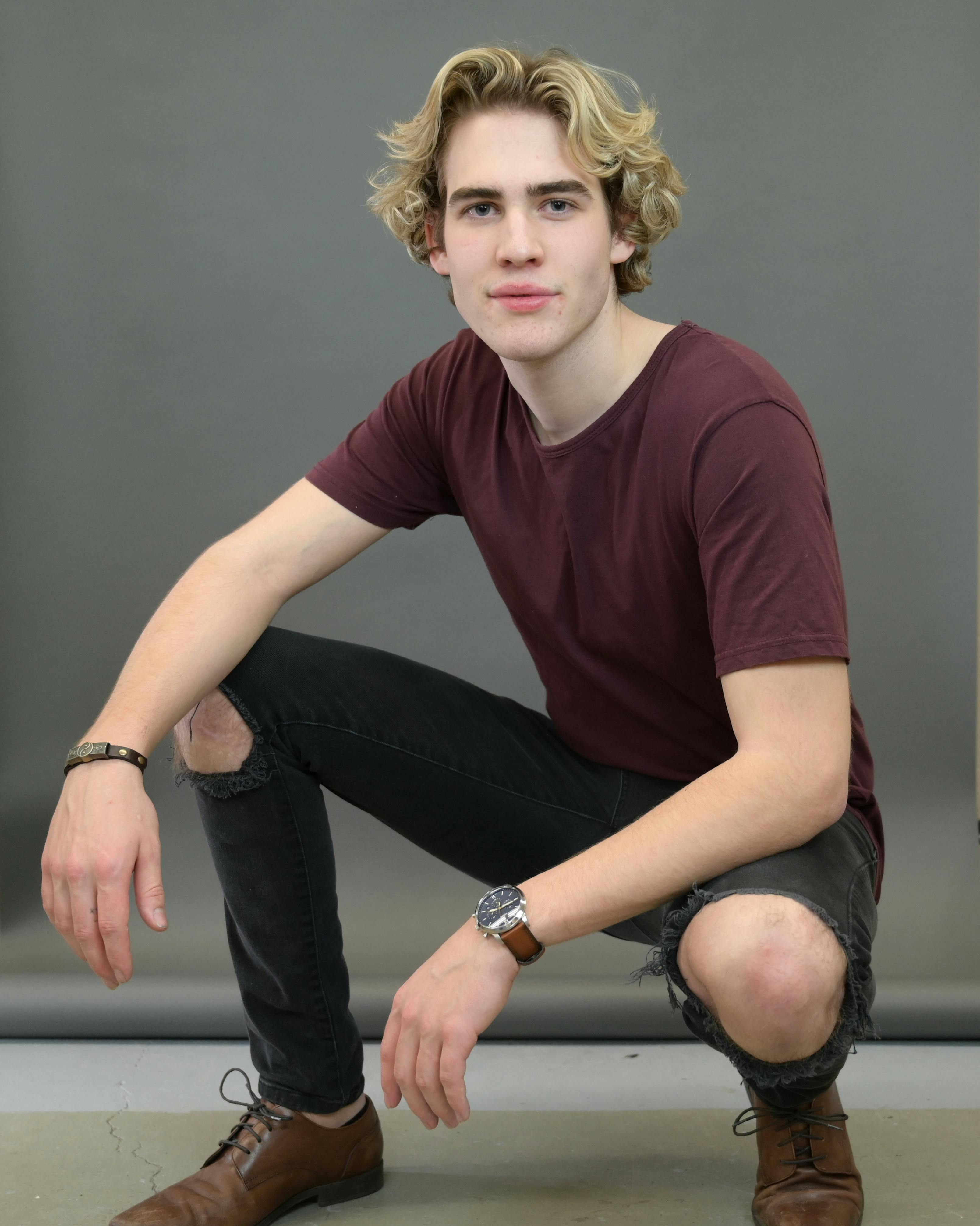 Portrait of a Man Crouching · Free Stock Photo