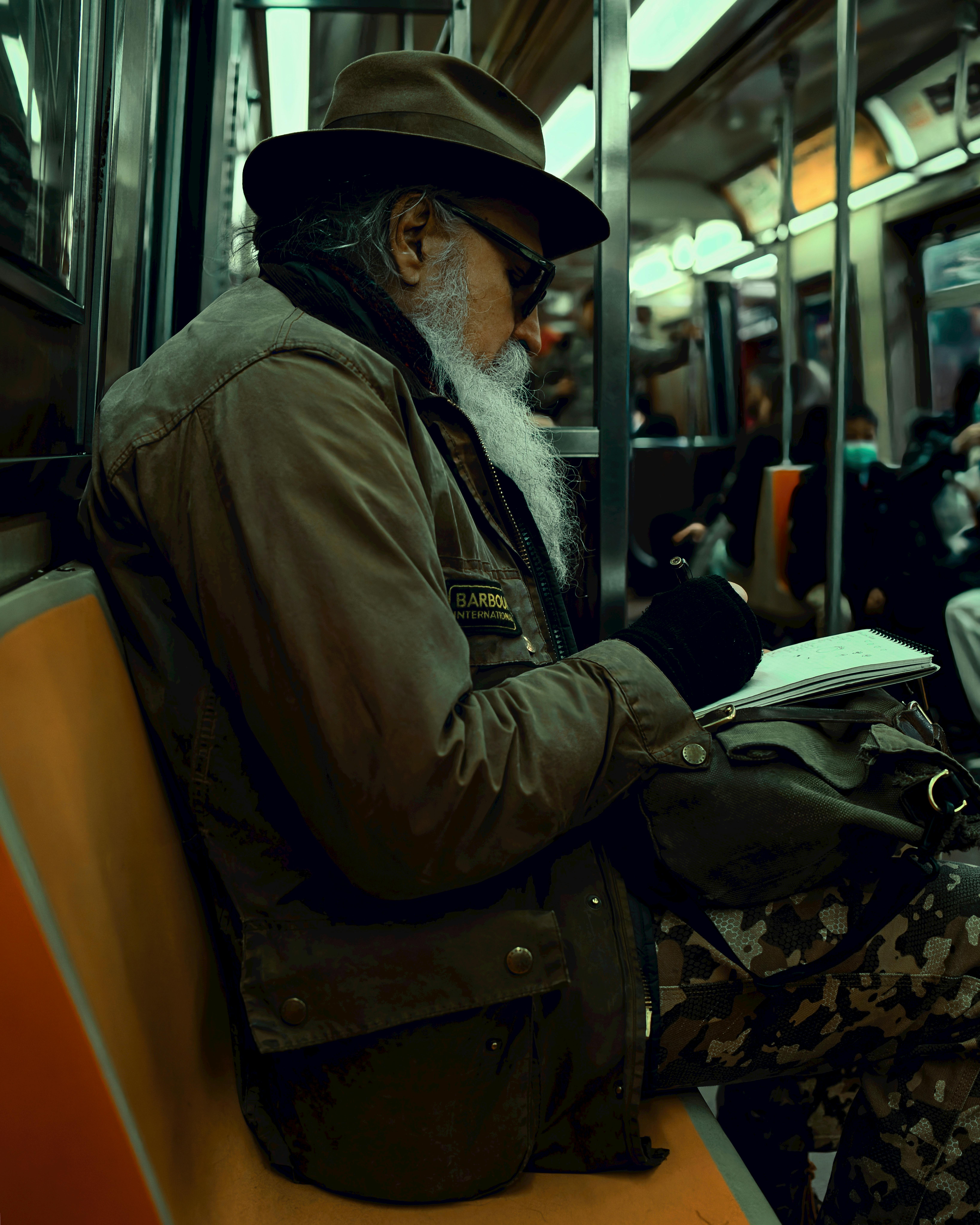 Elderly Man with Beard on Metro Train · Free Stock Photo