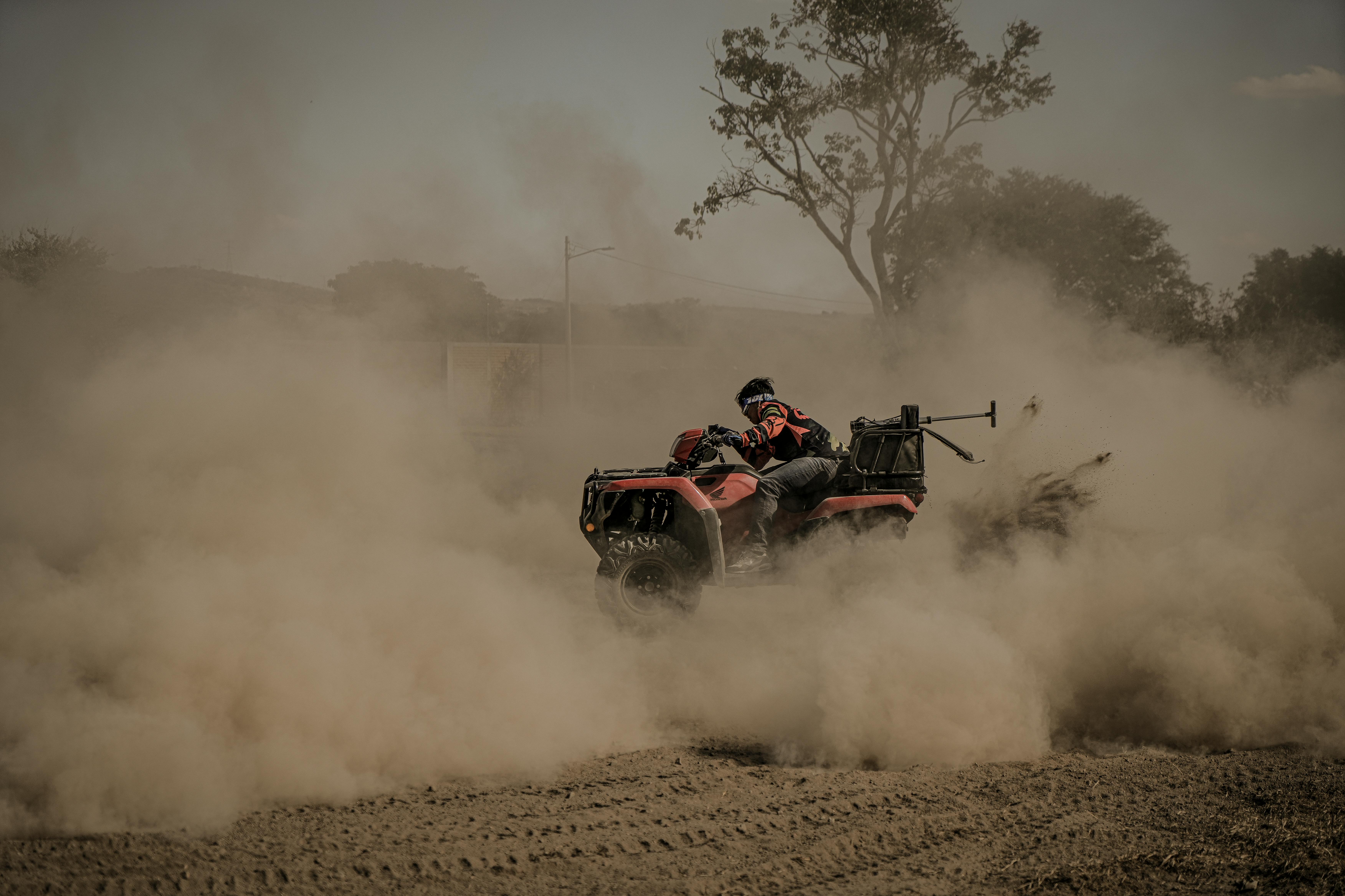 Man Riding on 4x4 Quad Bike · Free Stock Photo