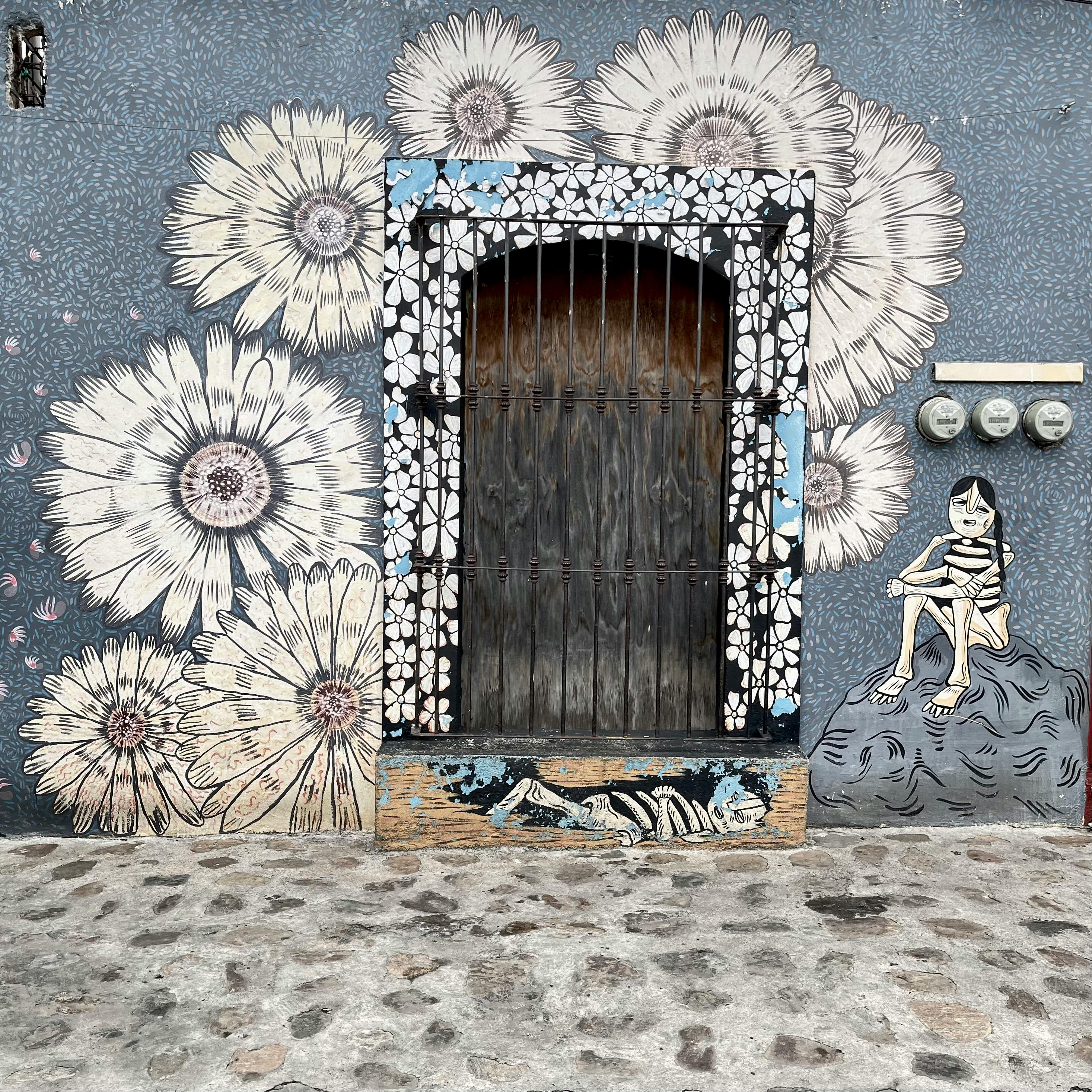 Floral Mural Around Wooden Door · Free Stock Photo