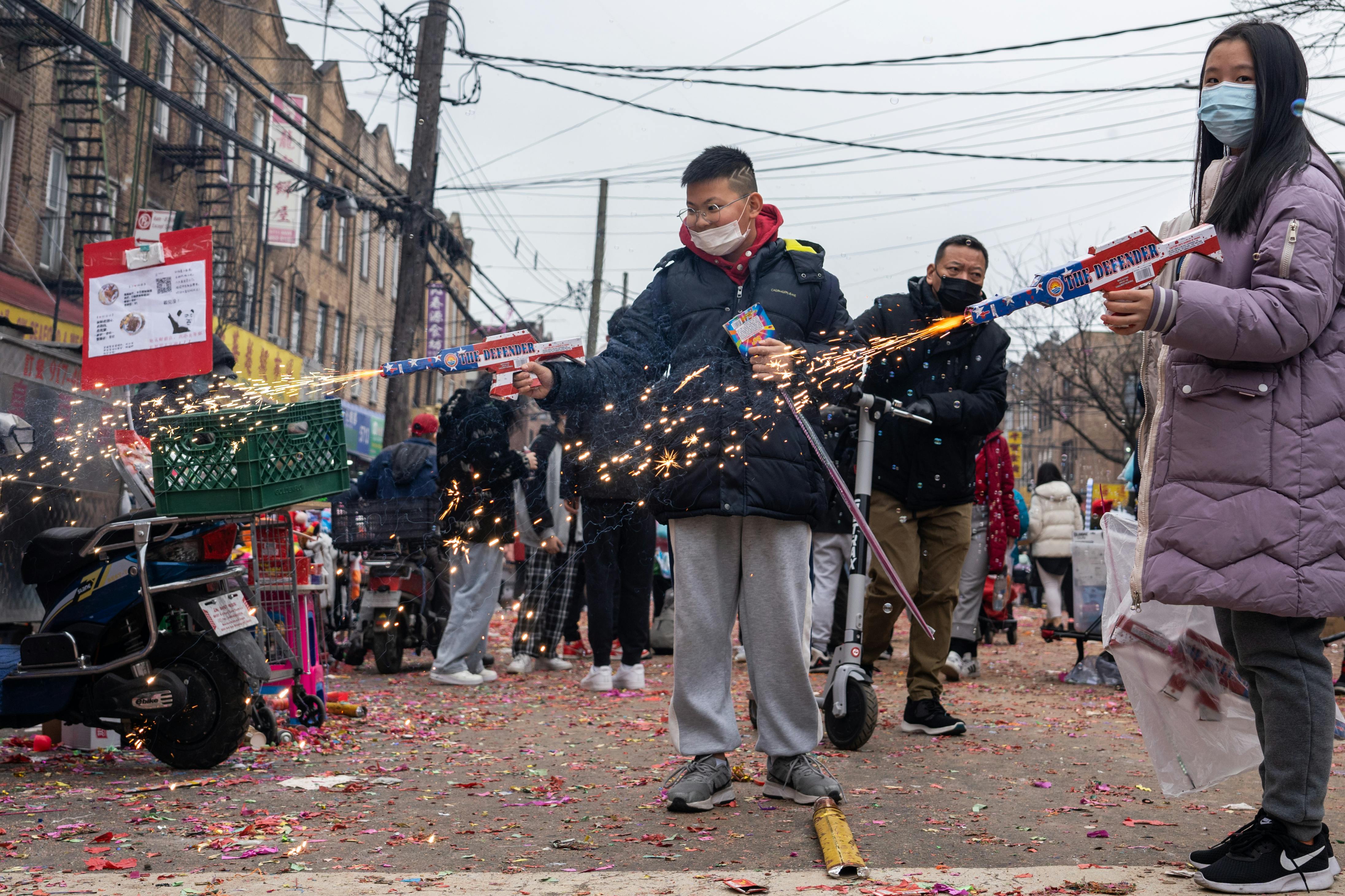 People with Fireworks in Alley in Town · Free Stock Photo