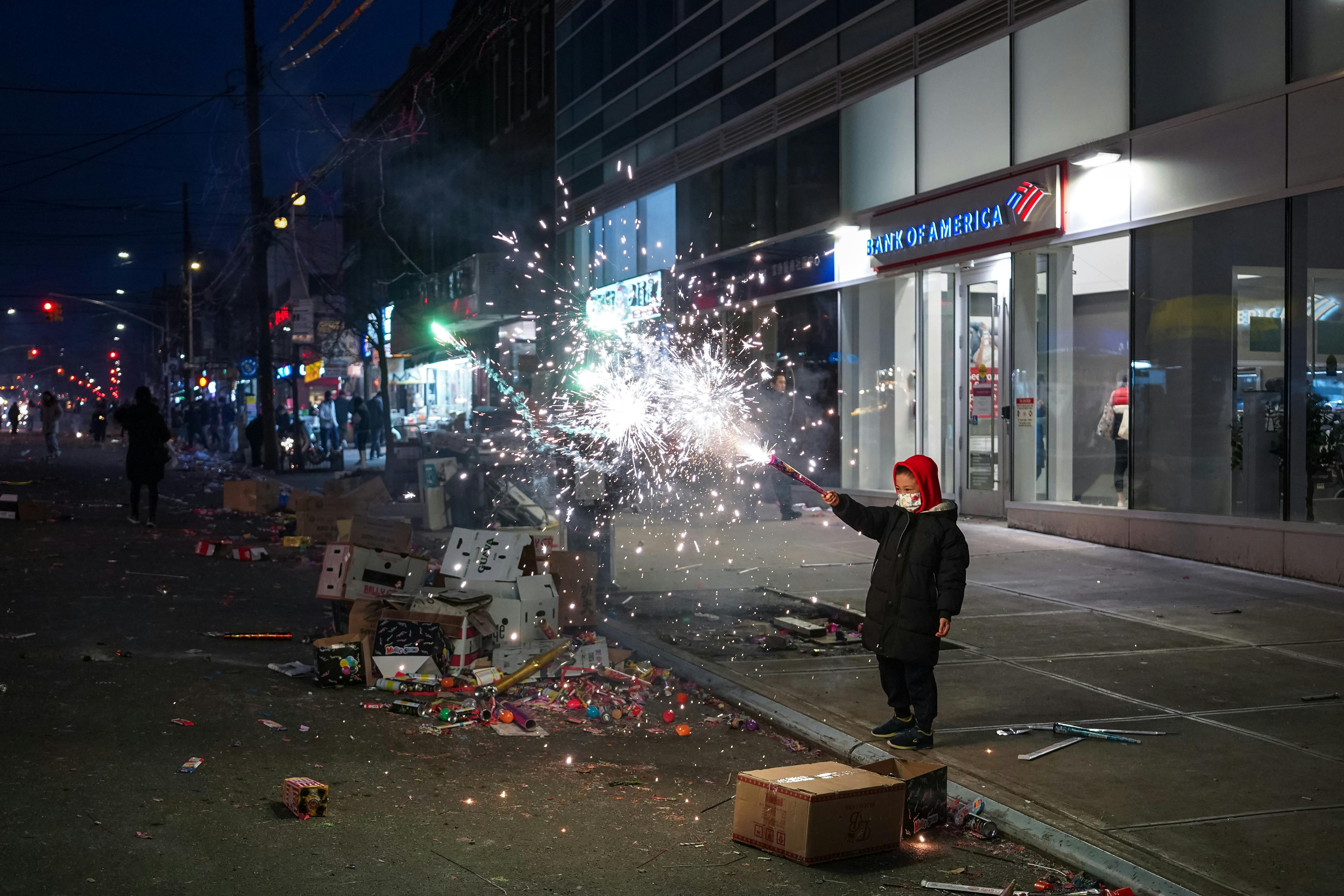 Person with Fireworks on Street at Night · Free Stock Photo