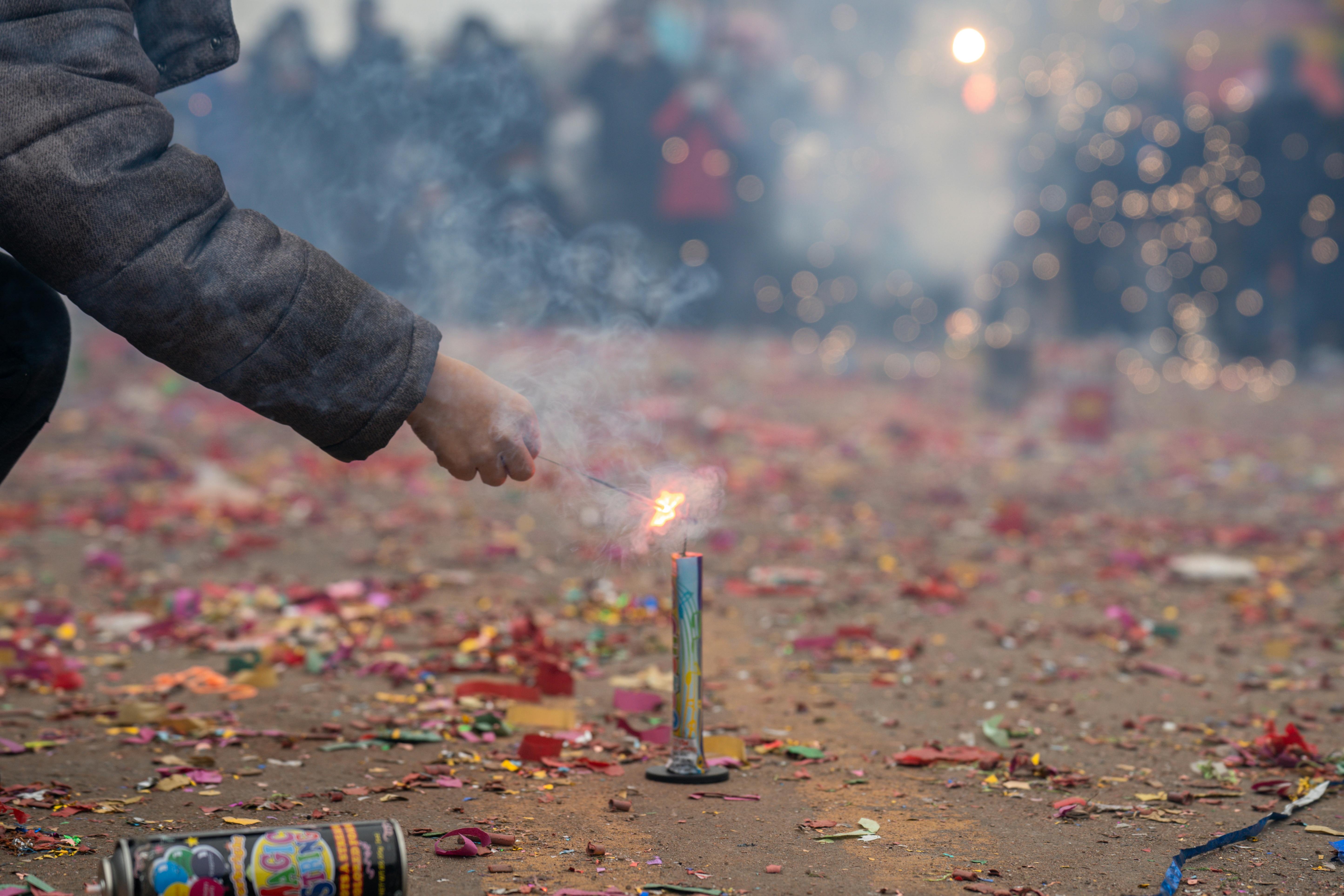 Close up of Hand Lighting Fireworks · Free Stock Photo